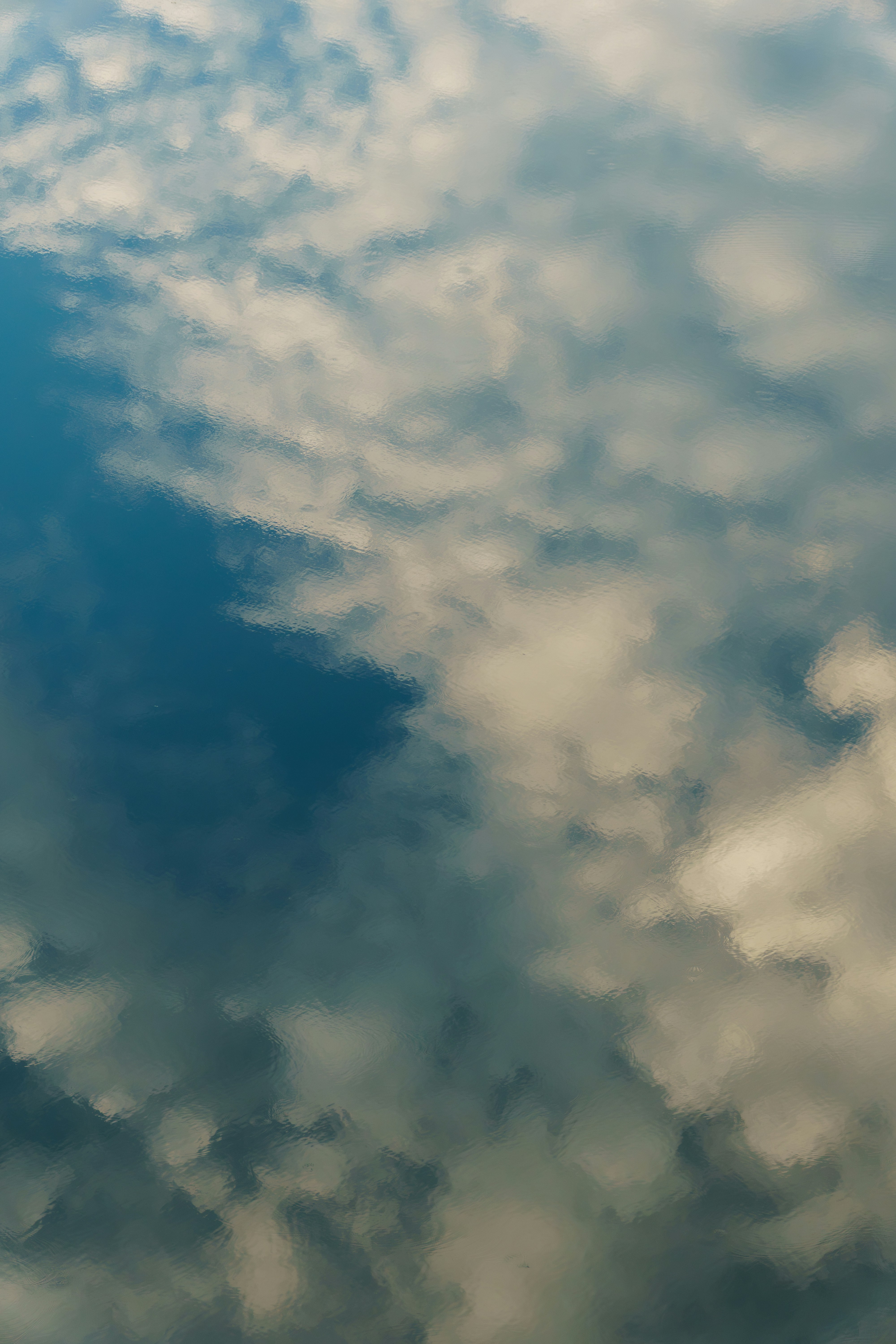 Cloudscape Drift: Pale Clouds Across a Quiet Sky