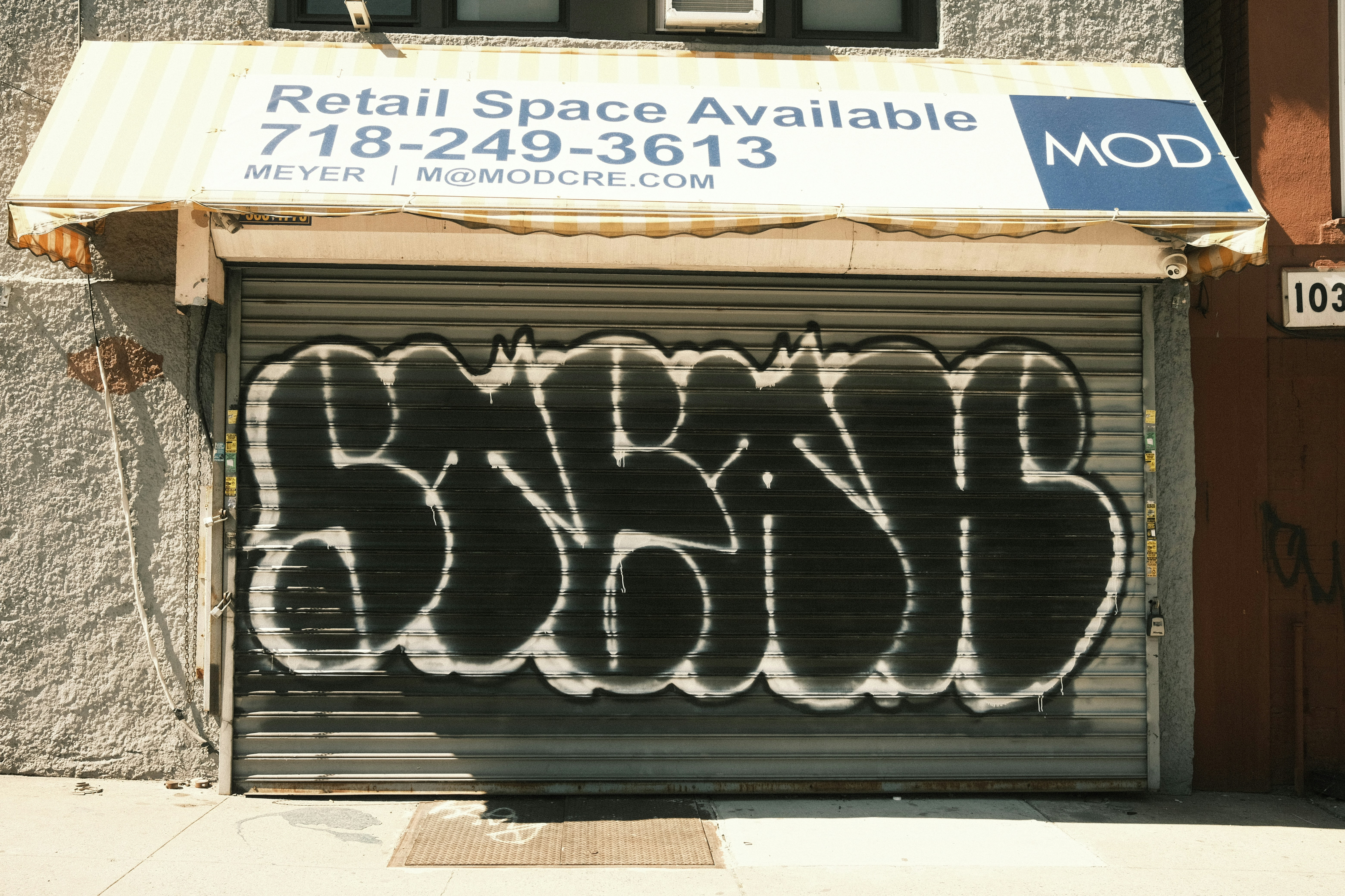 Graffiti Gate: Urban Shutter Under the Sign