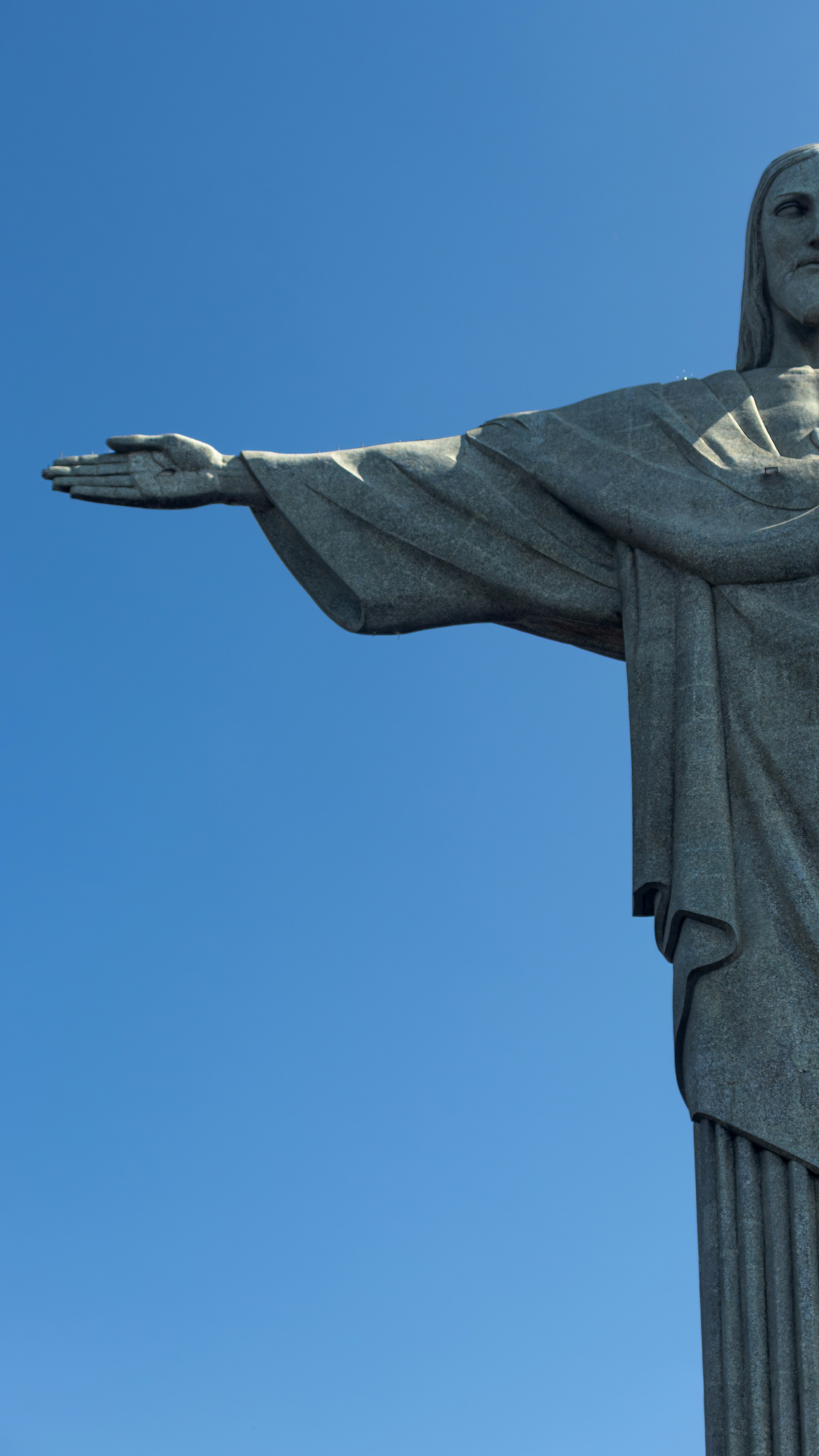 Arms of Welcome: The World-Scale Monument in a Clear Blue Sky
