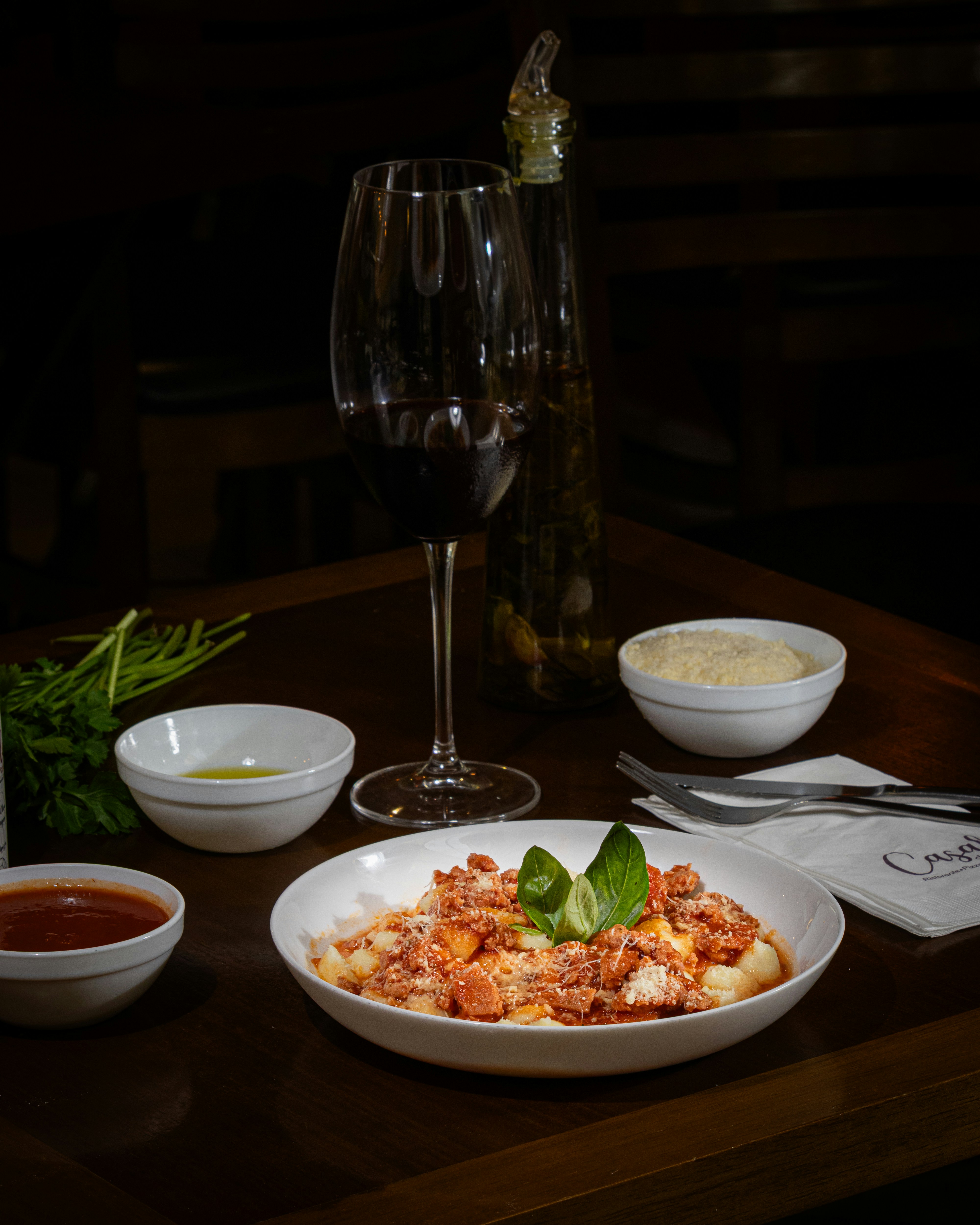 Centered Plate: Pasta Parmigiana on a Rustic Table