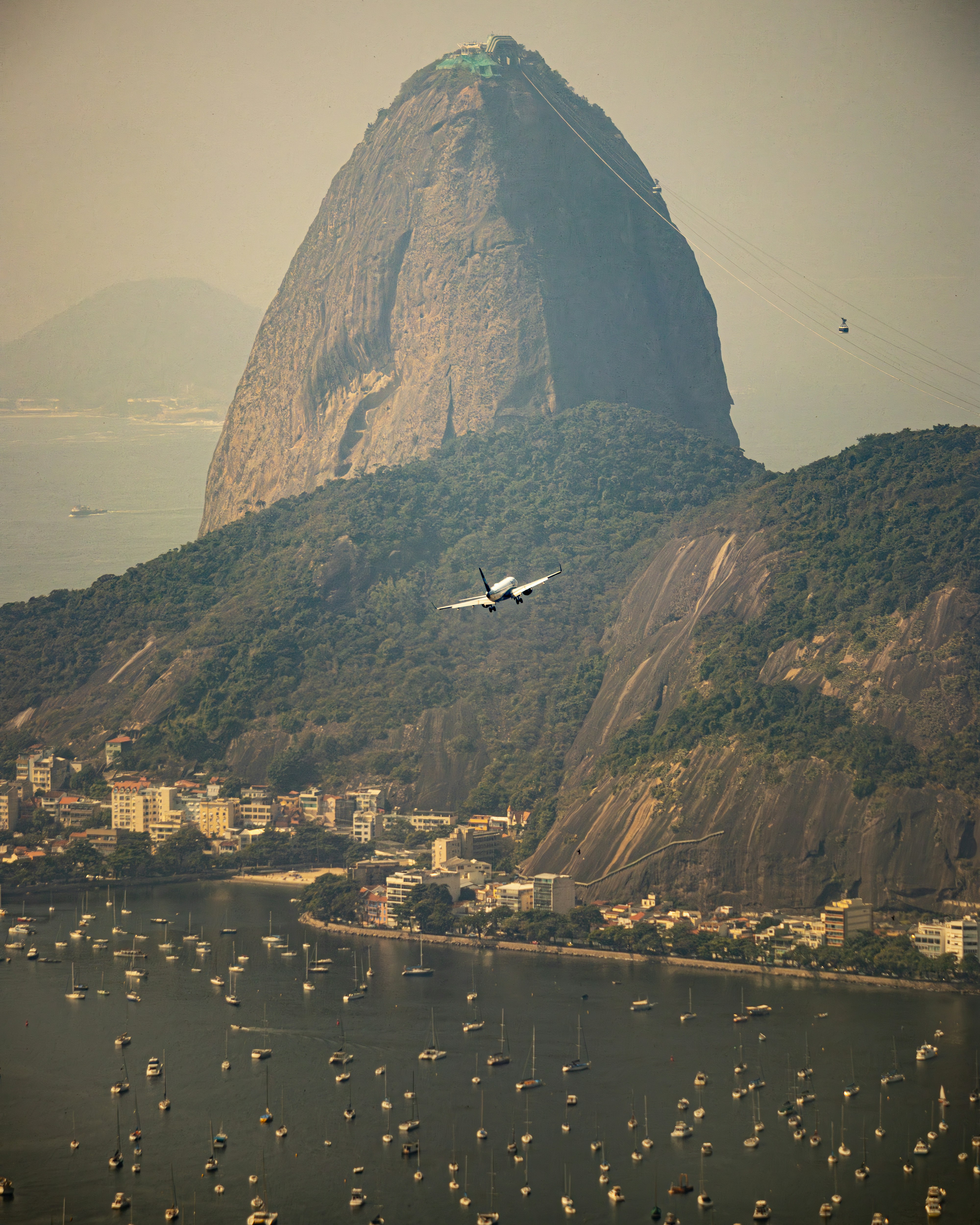 Giant Granite Sentinel Over a Quiet Coastal City