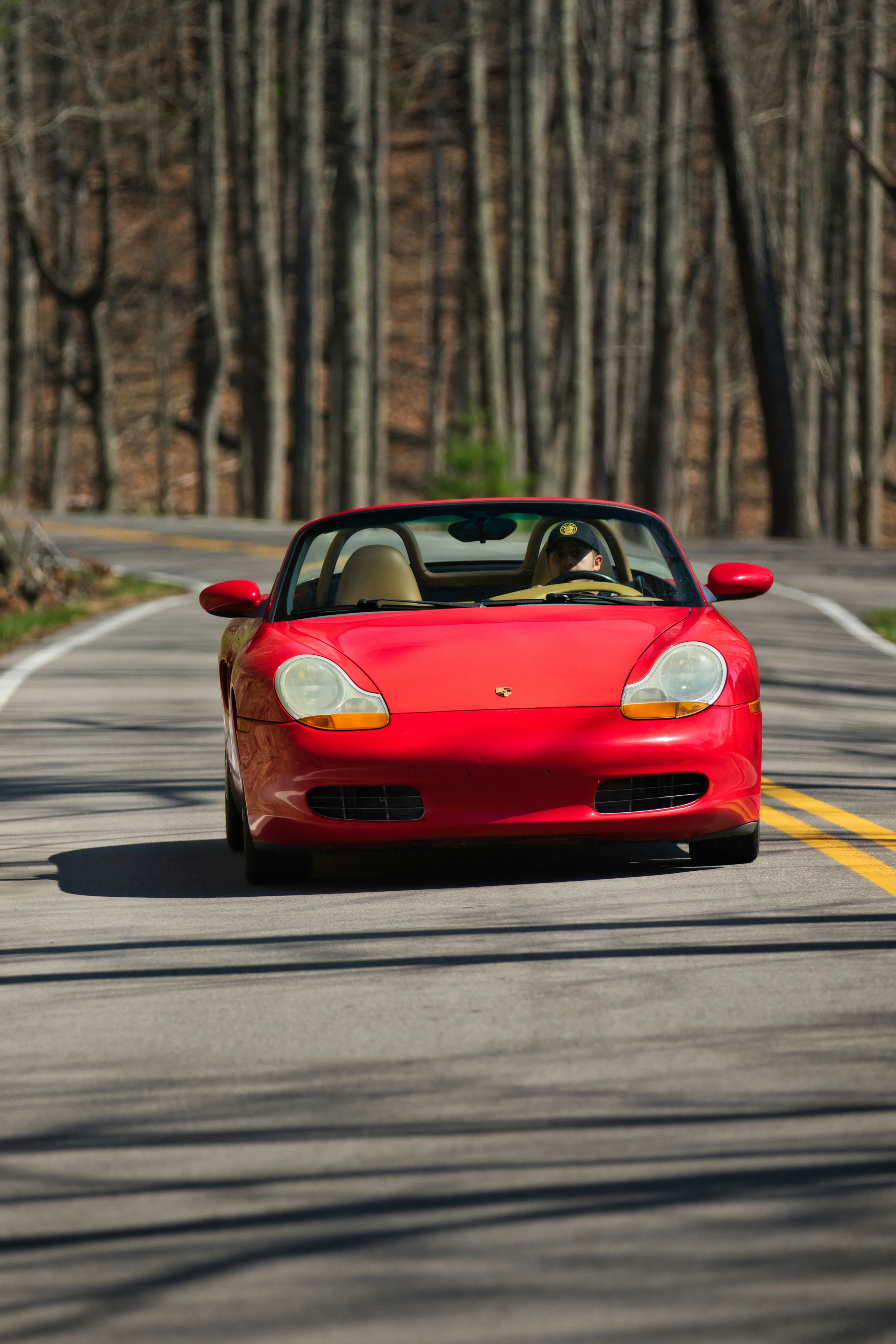 Red Convertible on a Curved Backroad: A Forward-Facing Drive