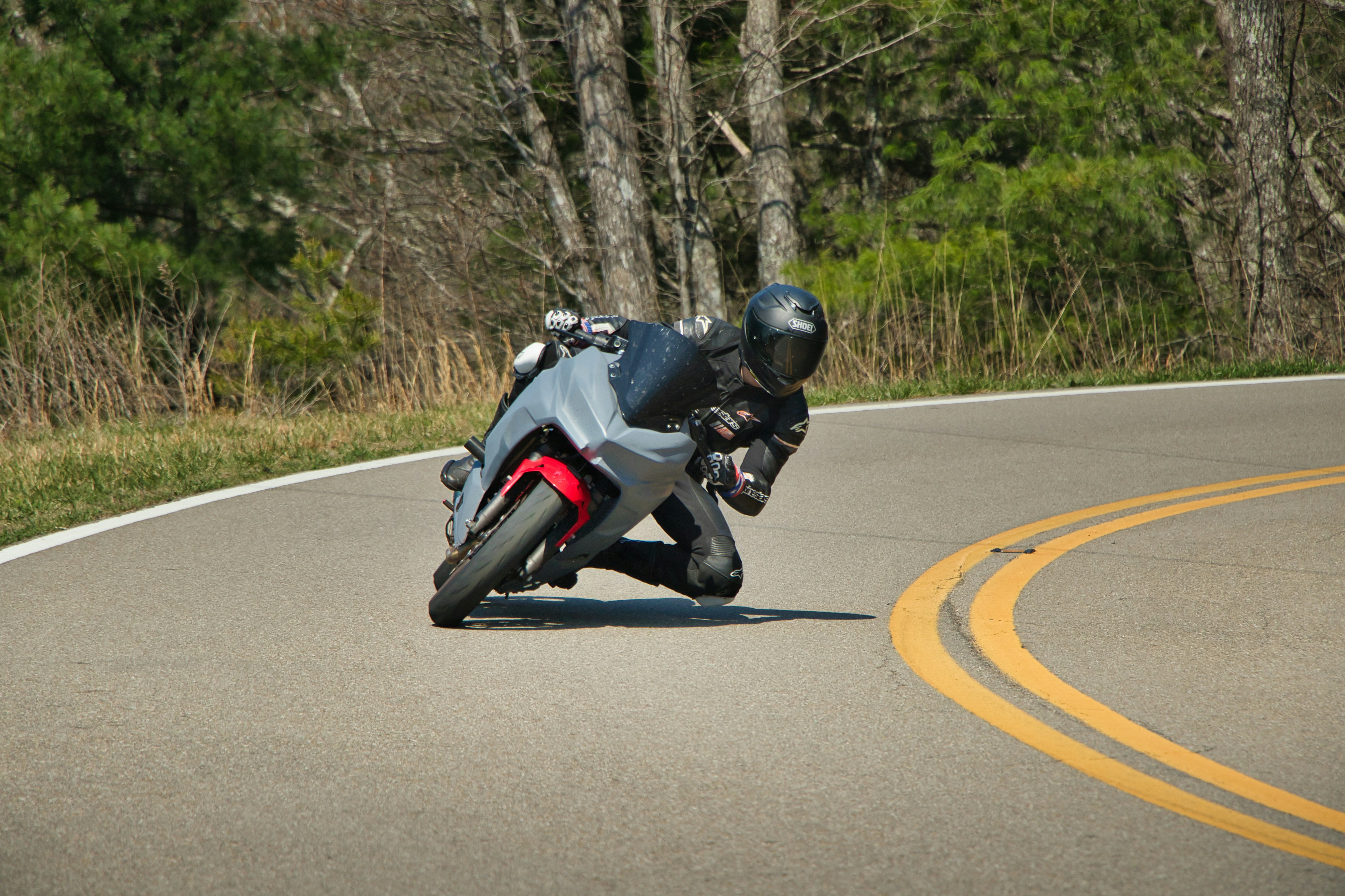 Lean into the Curve: Rider Tightens the Line on a Turns-Only Road