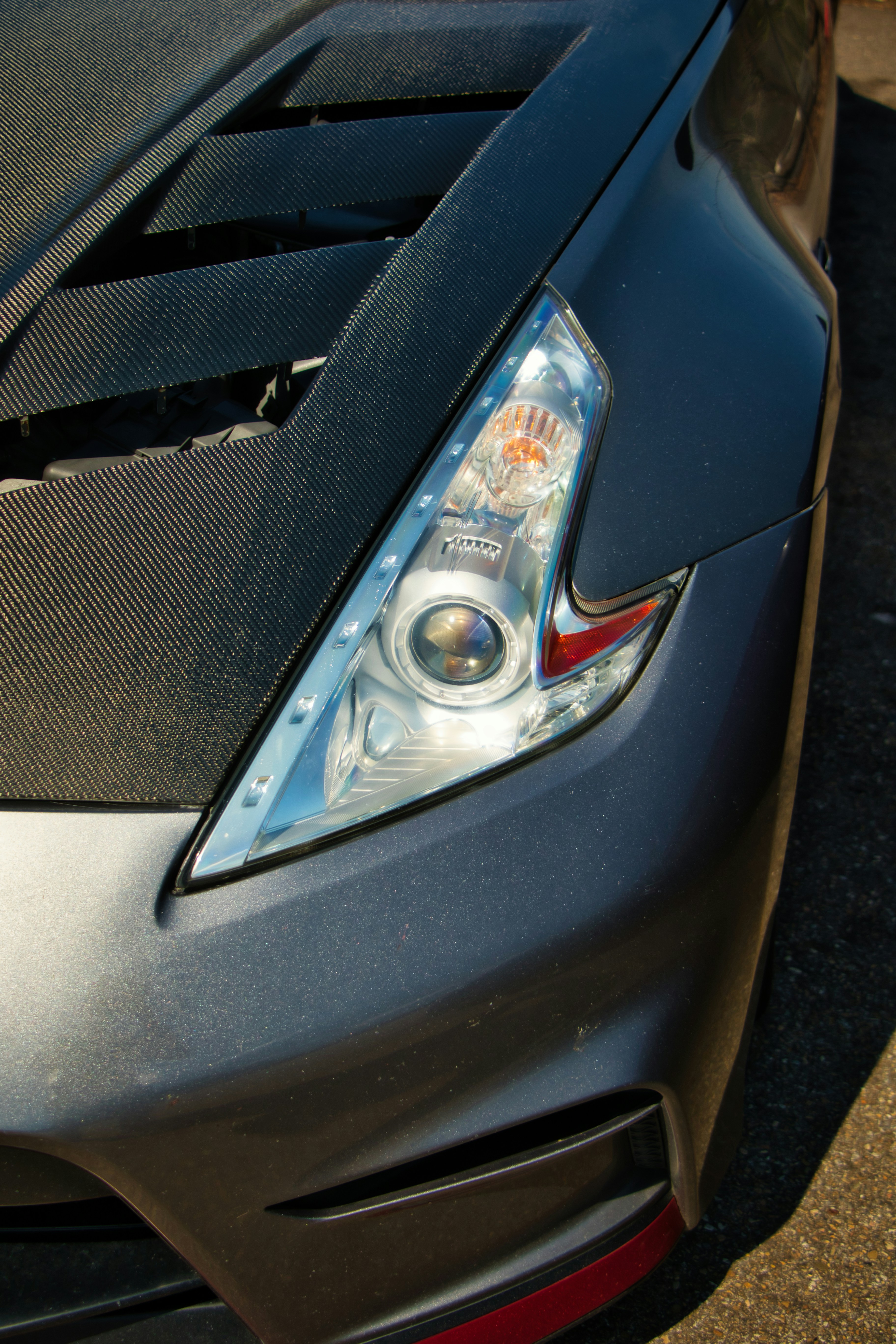 Blue Front Grille and Headlight Panel: A Bold Car Close-Up