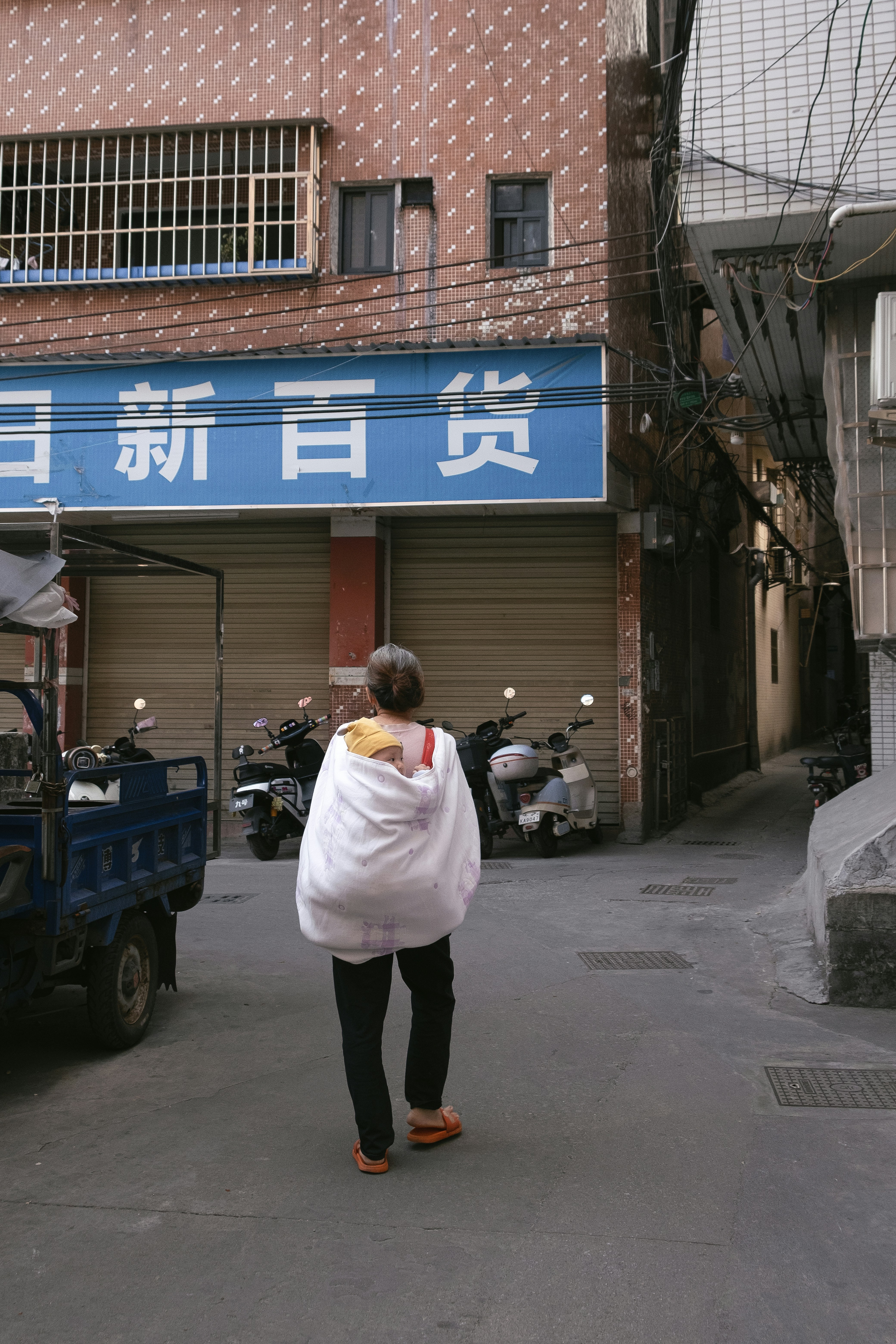 Urban Streetwalker: A Quiet Corridor Toward the Shopfront