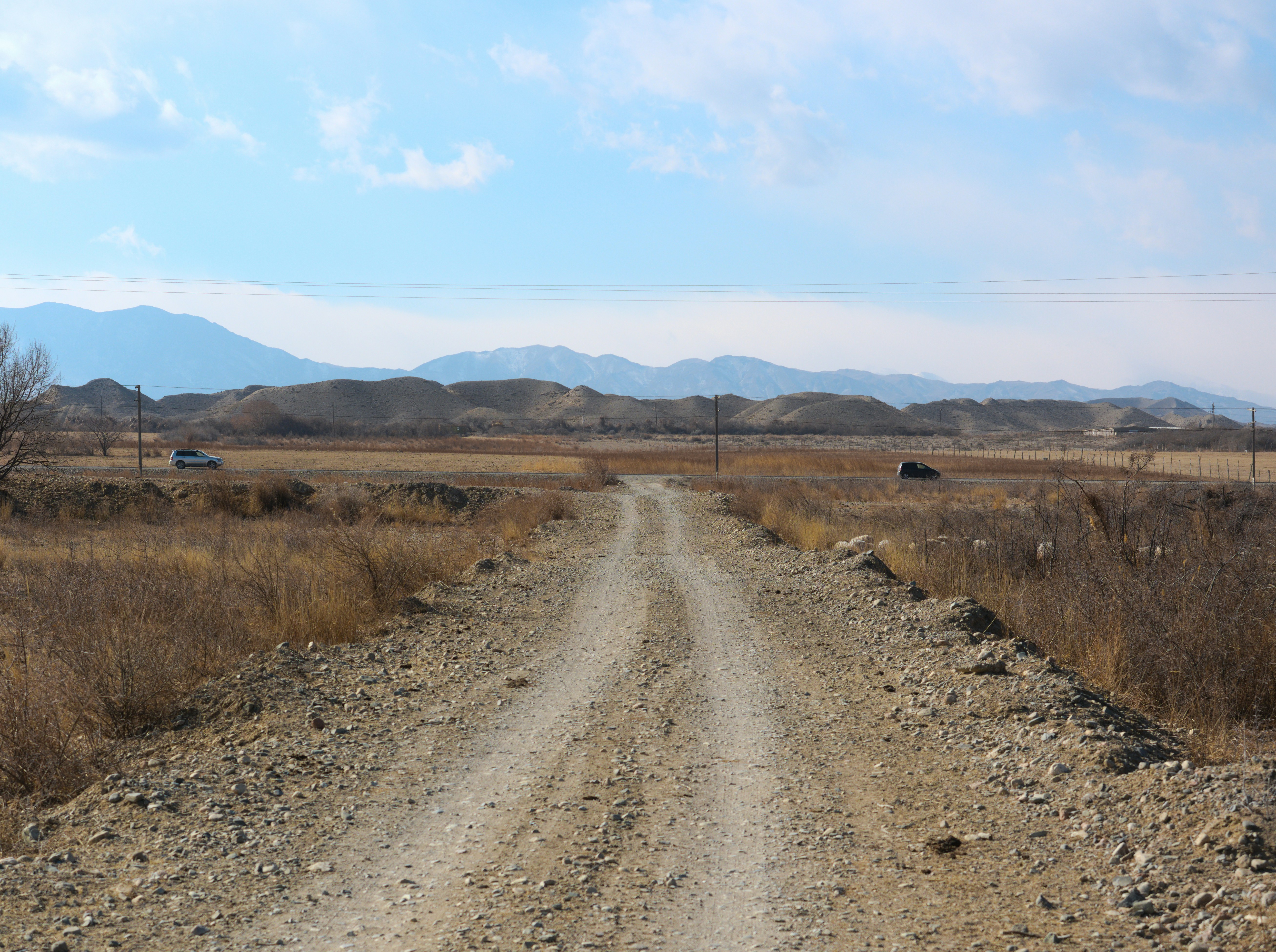 Desert Gravel Path: A Quiet Road to Distant Mountains