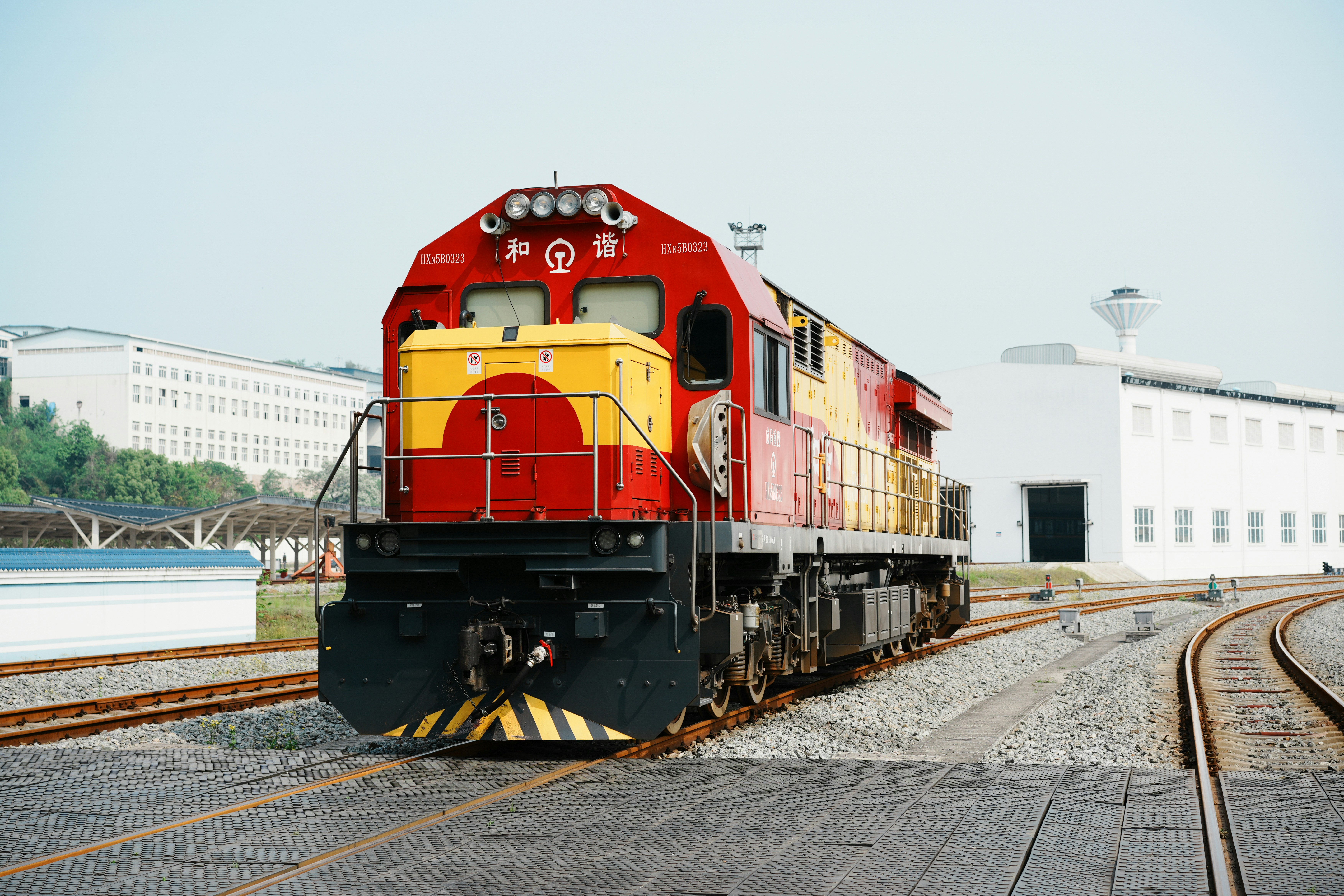 Red Locomotive at the Edge of the Yard