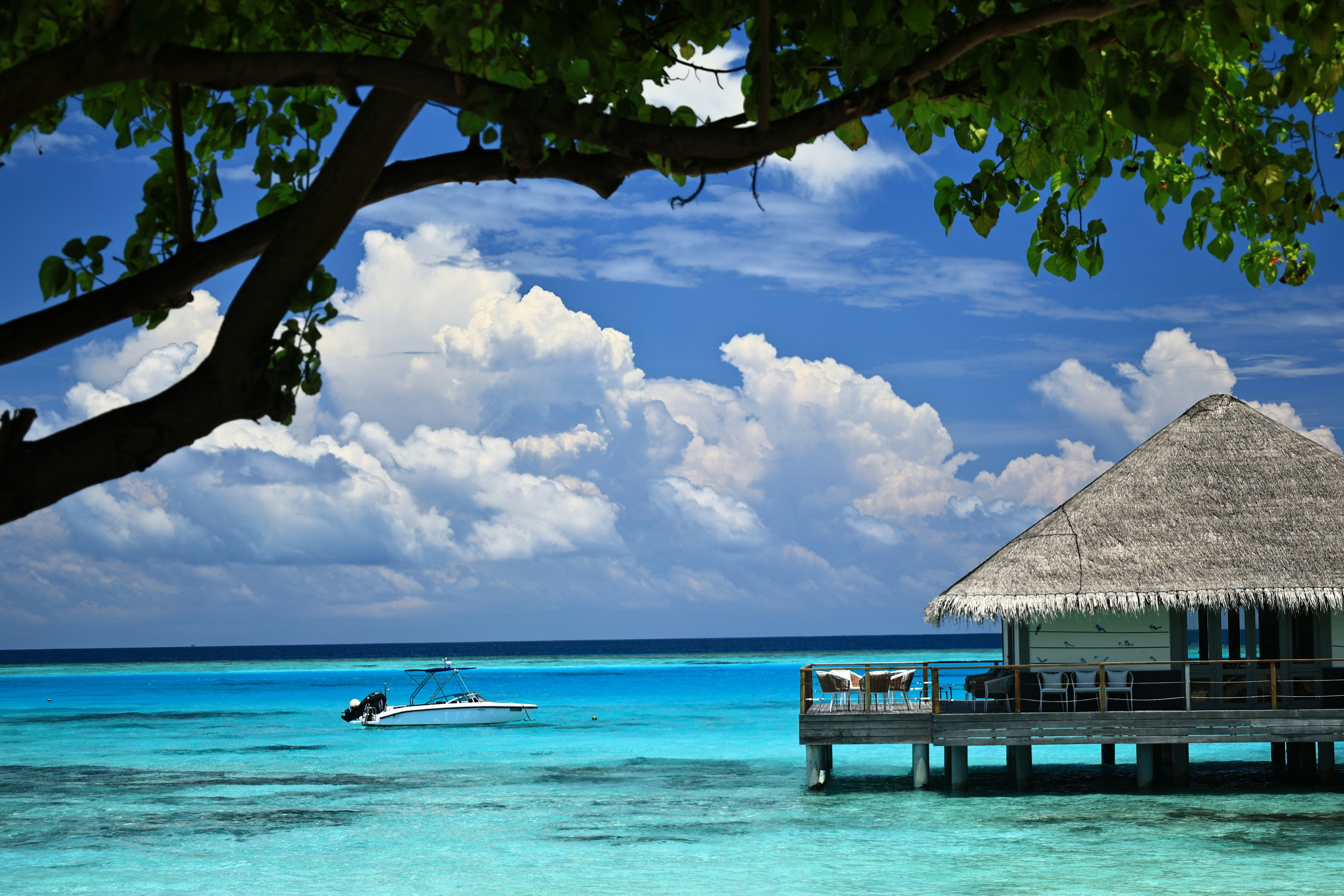 Overwater View: Terrace Hut and Turquoise Sea