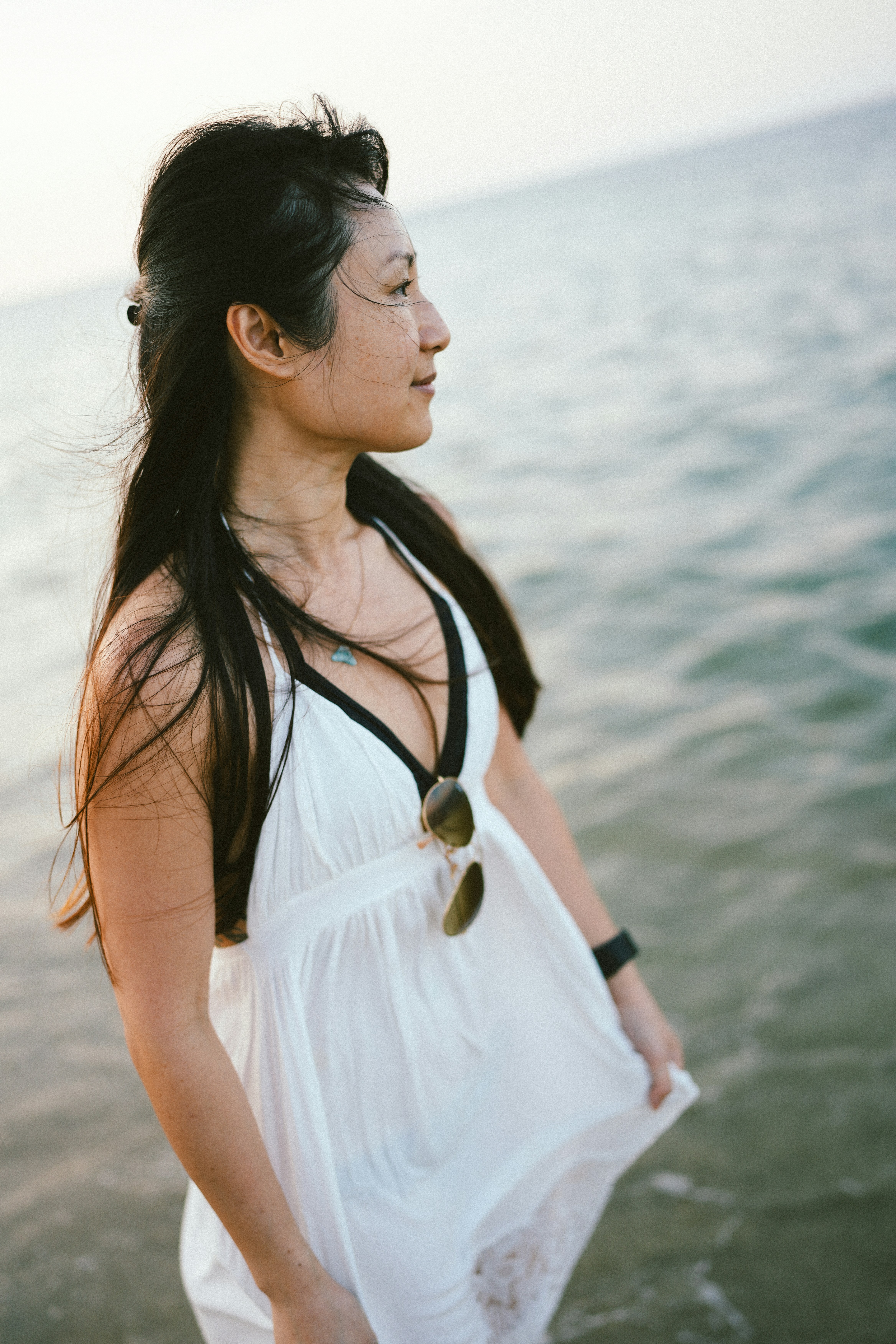 Seaside Quiet: A Portrait with Wind-Kissed Hair