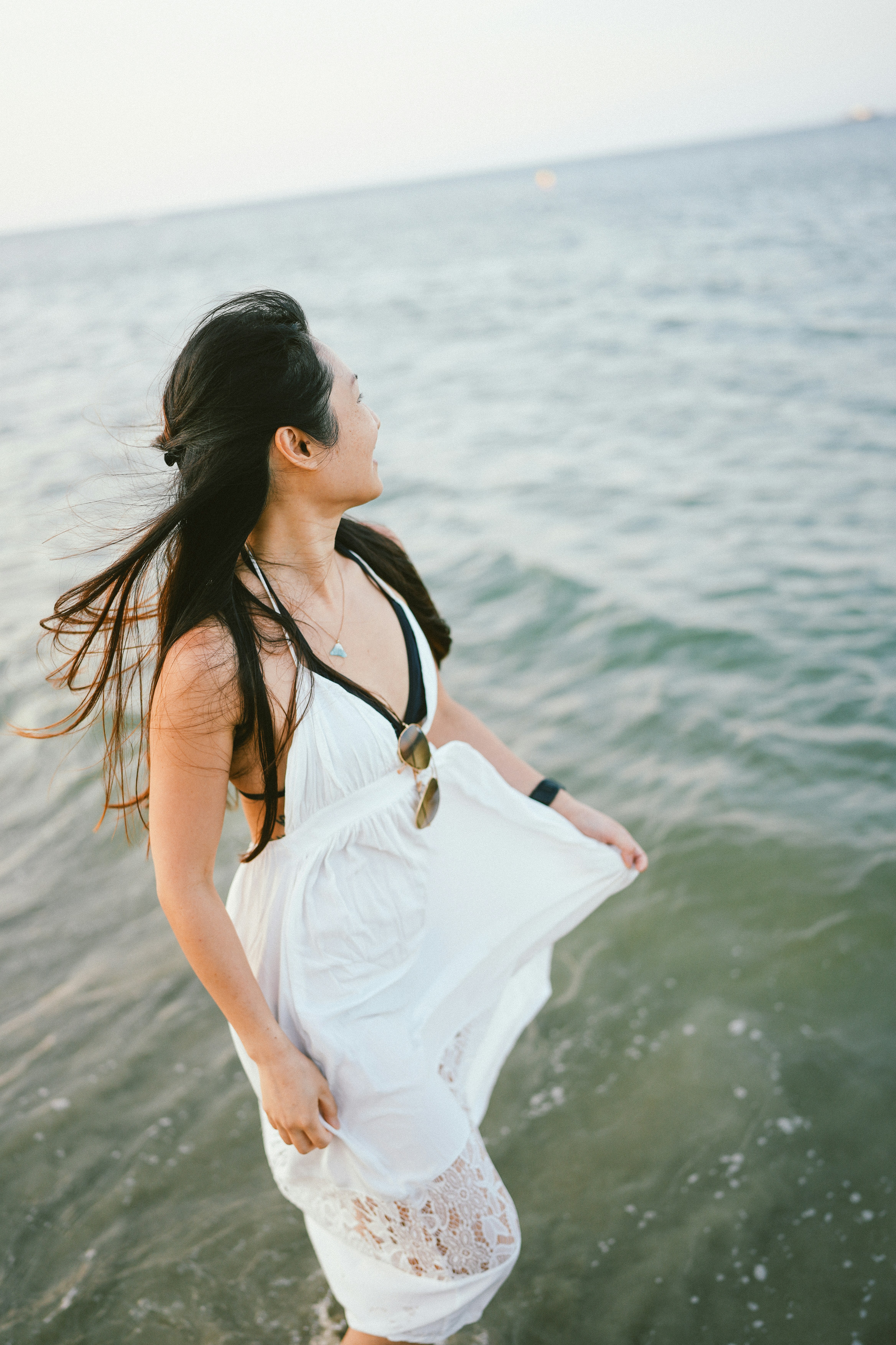 Wind-Tossed White dress by the Sea