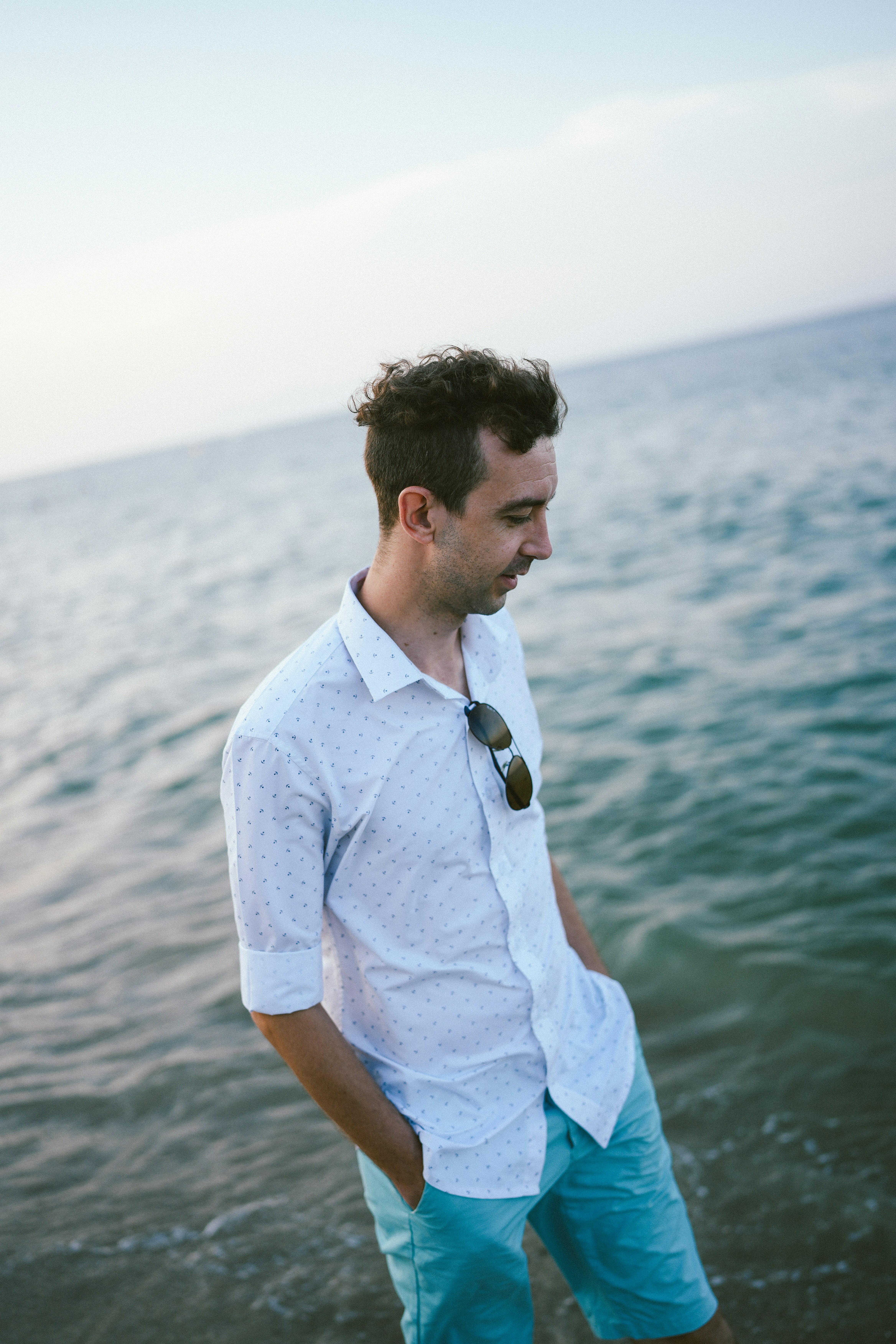 Seaside Calm: A Pensive Portrait by the Water