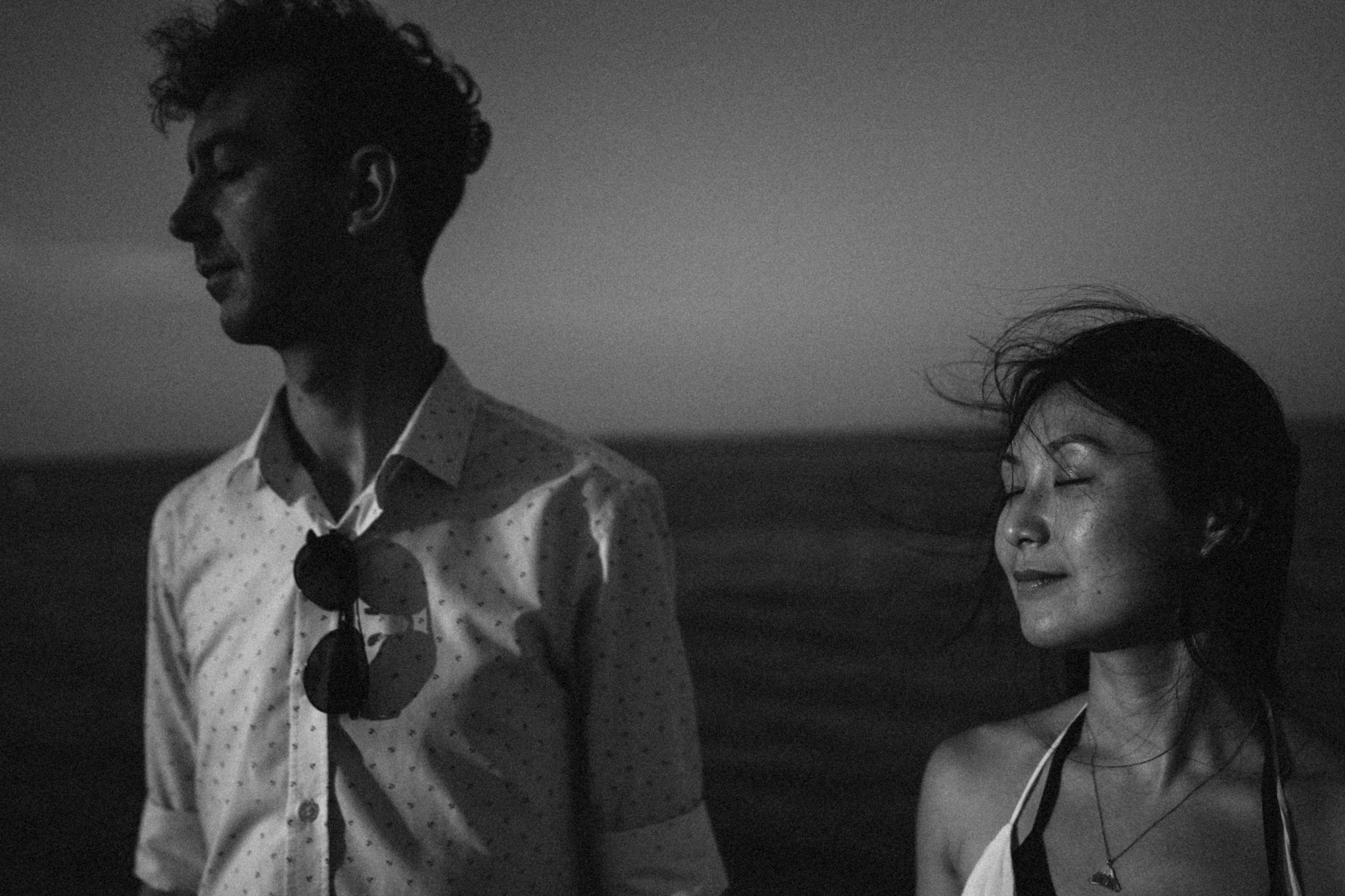 Quiet Sophistication: Two Figures on a Dusk-Soaked Shore