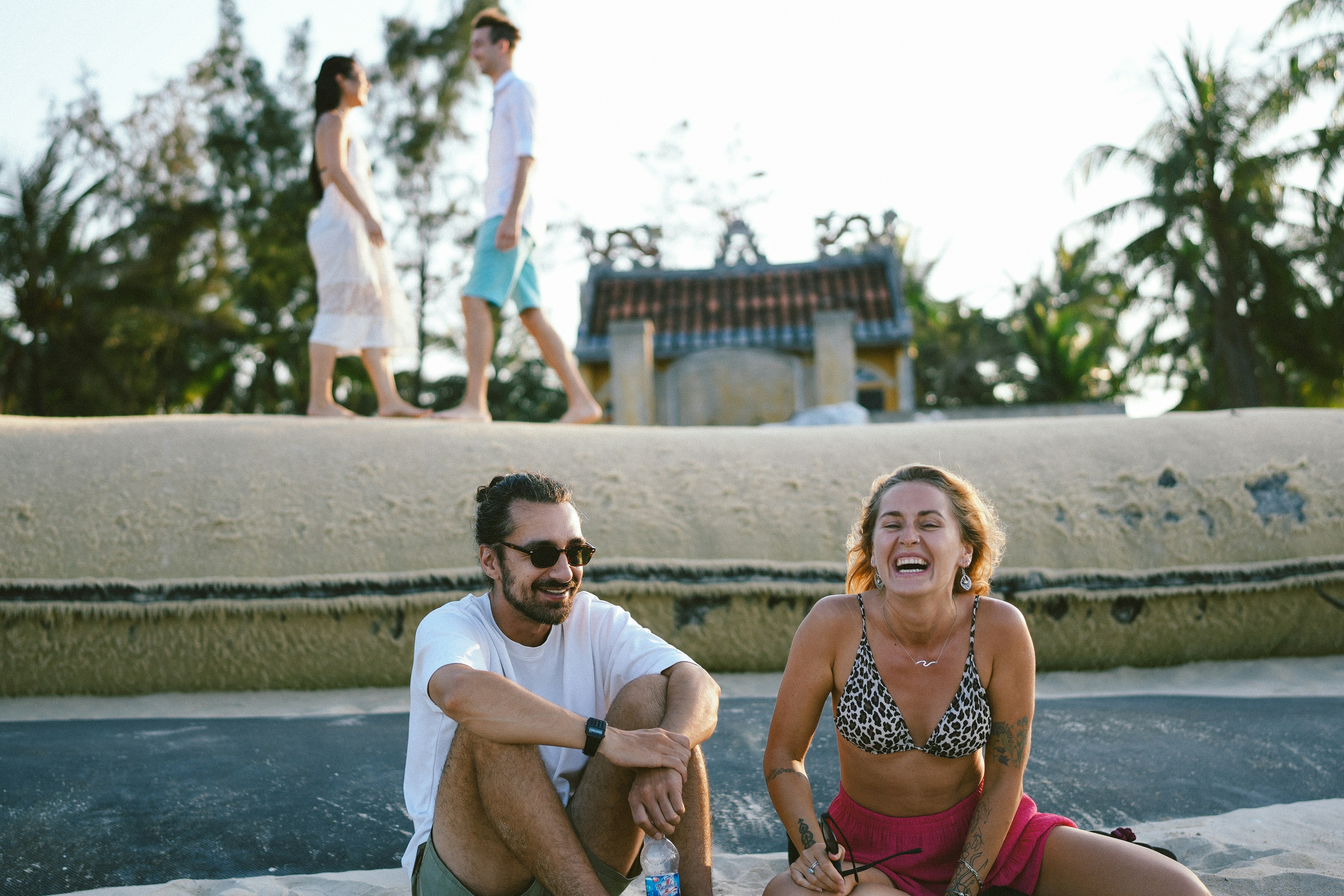Sunlit Laughter by the Pool: Friends Share a Moment