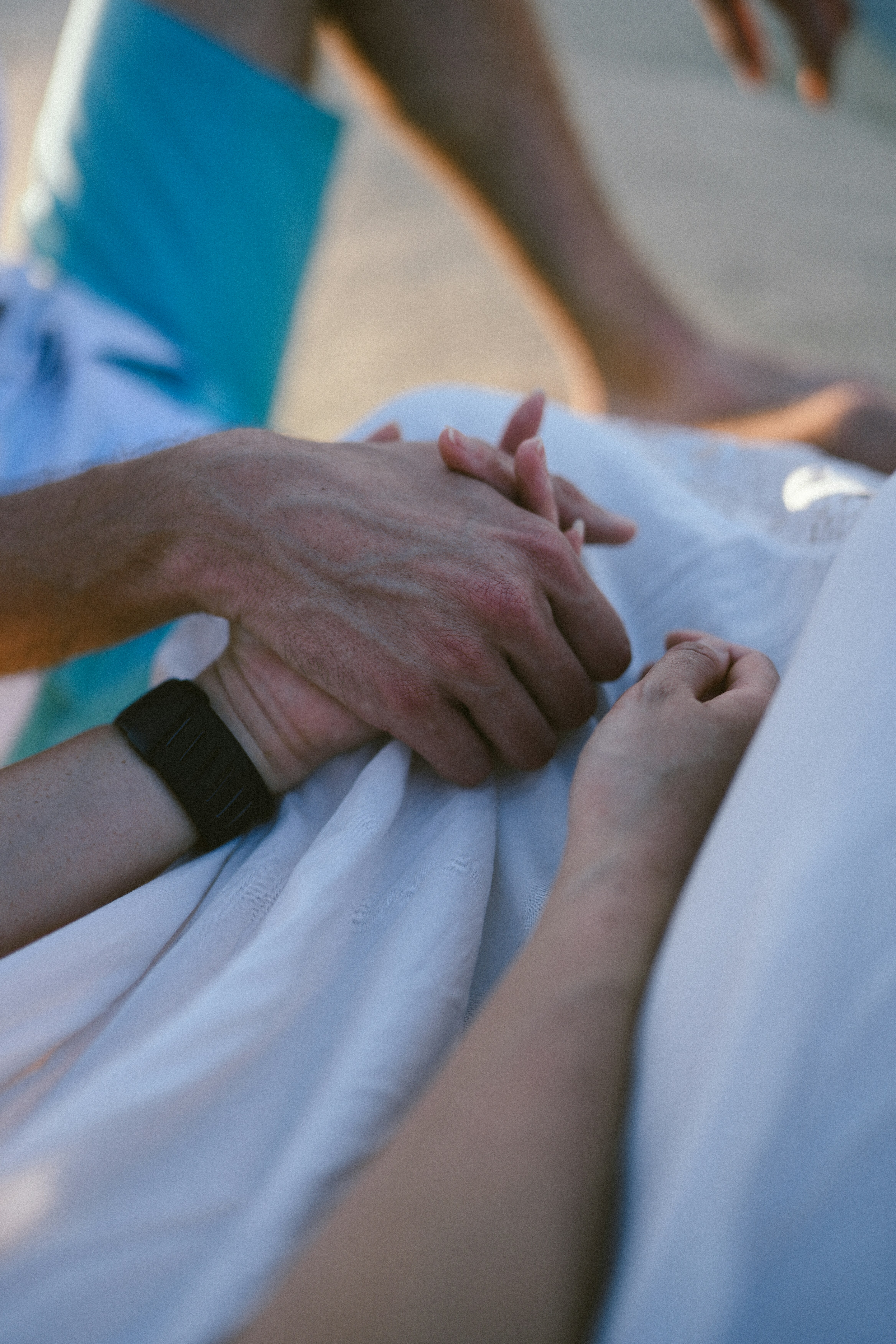 Holding On: A Quiet Moment of Connection by the Shore