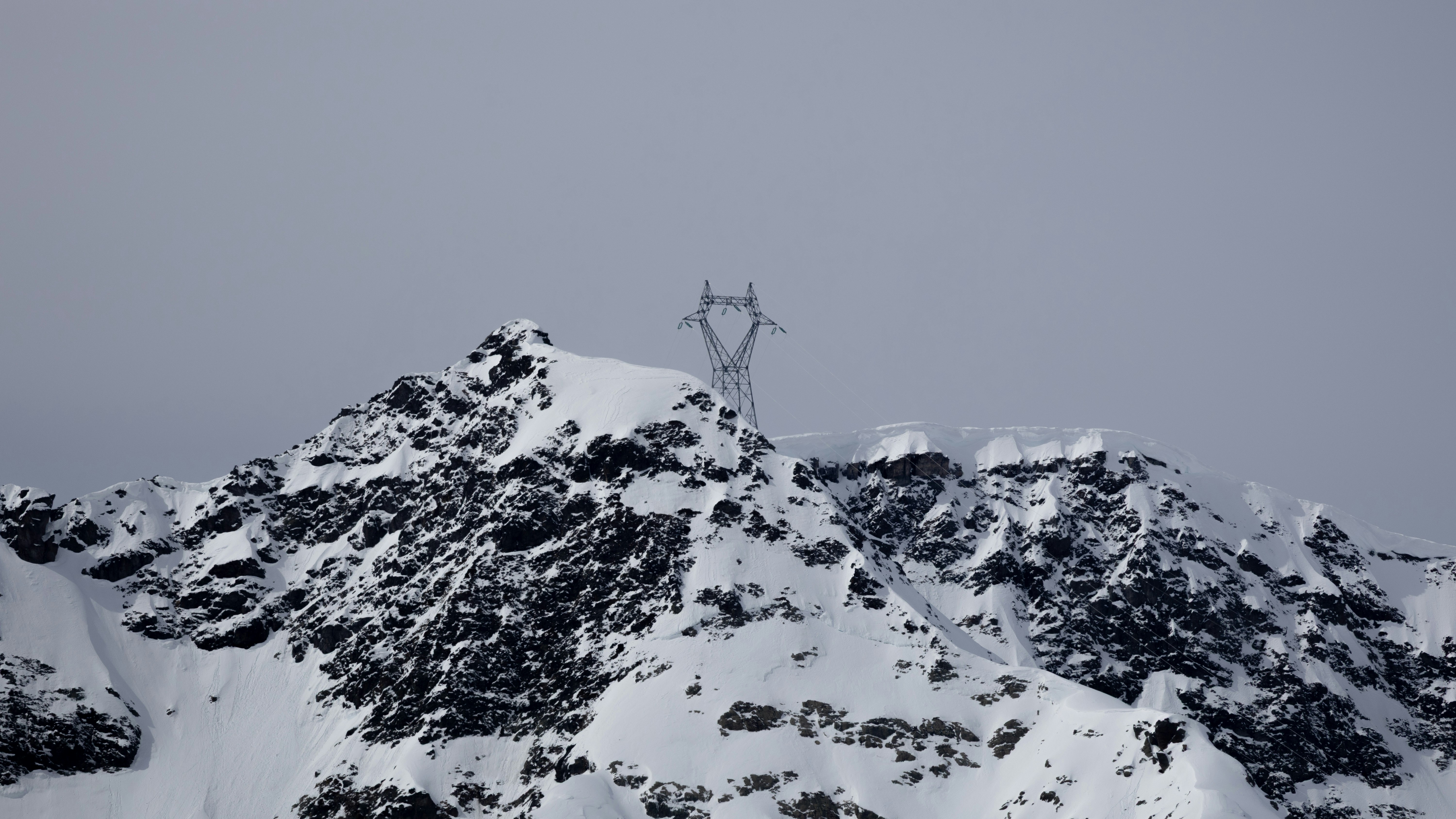 Snowbound Ridge: A Transmission Tower Crowned Peak