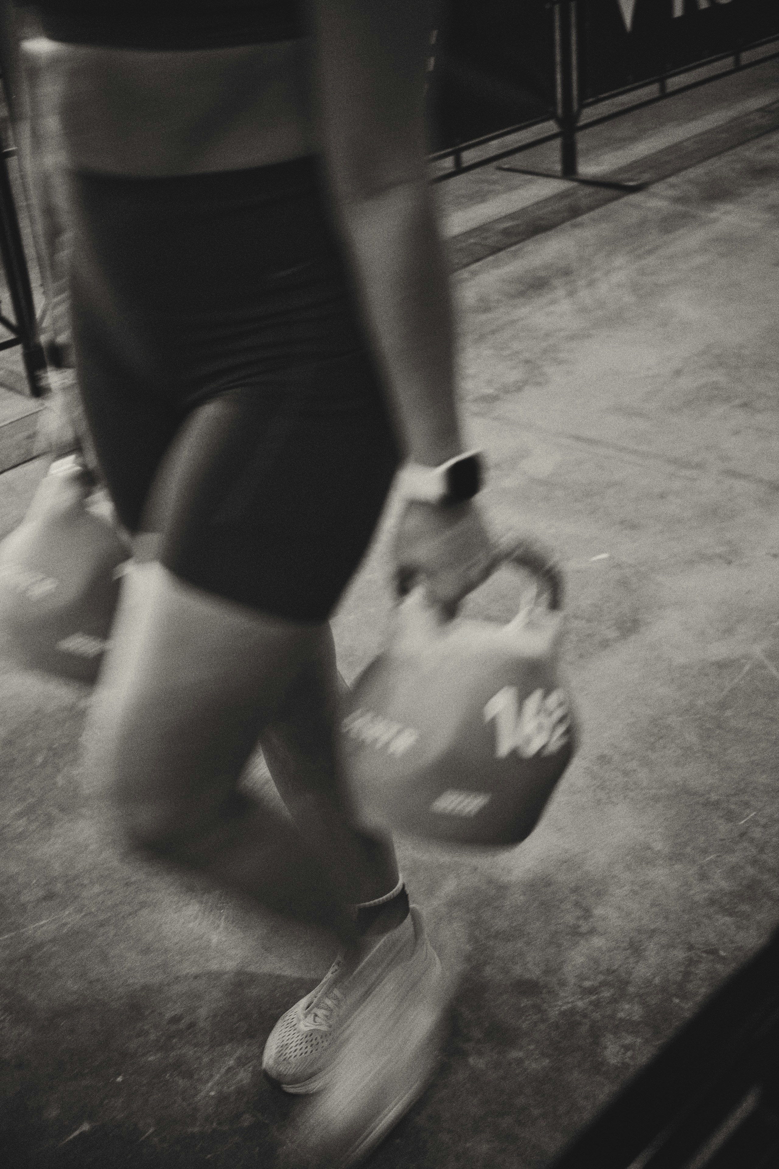 Motion through the gym: a cyclist carries racing kettlebells