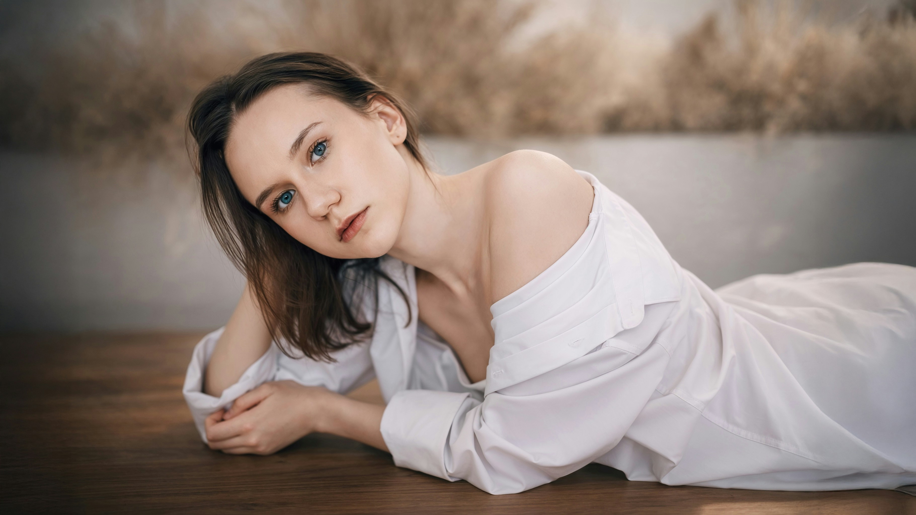 Poised in Linen: A Quiet Portrait by the Water