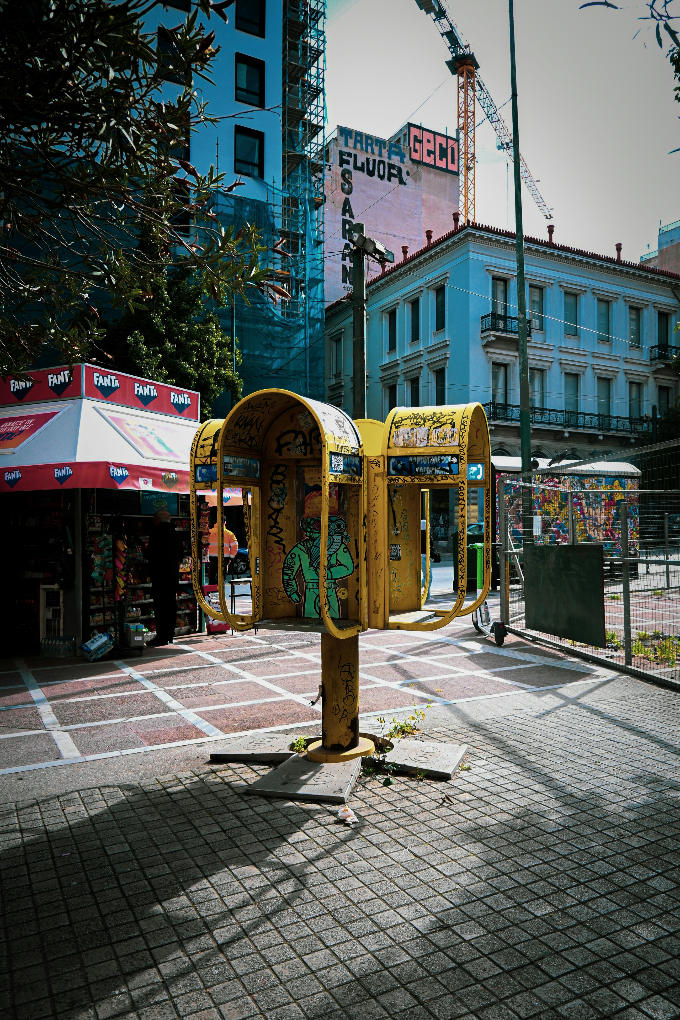 Urban Playground: The Yellow Carousel Amid Streetlife