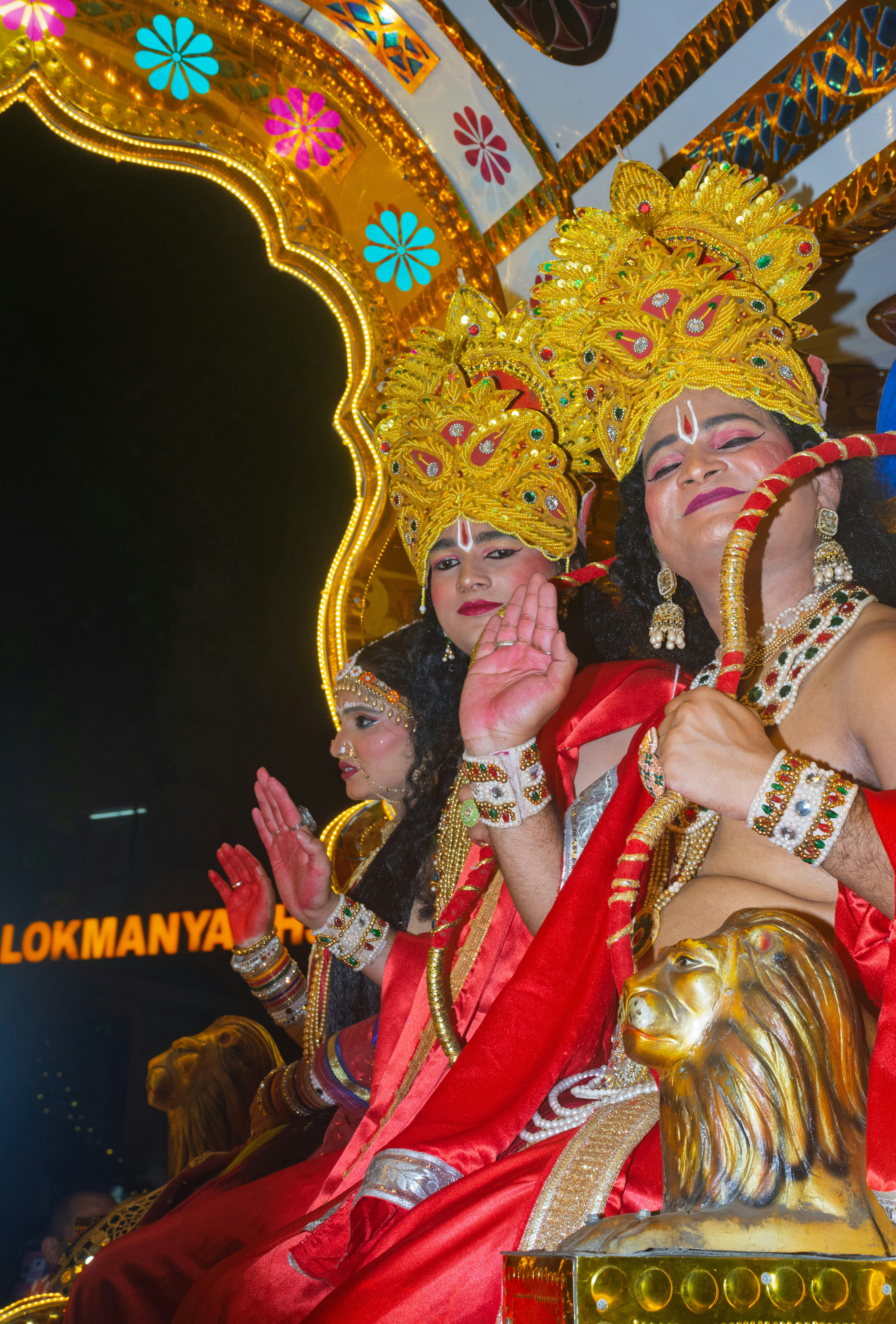 Golden Carnival Dancers Under Neon Archway