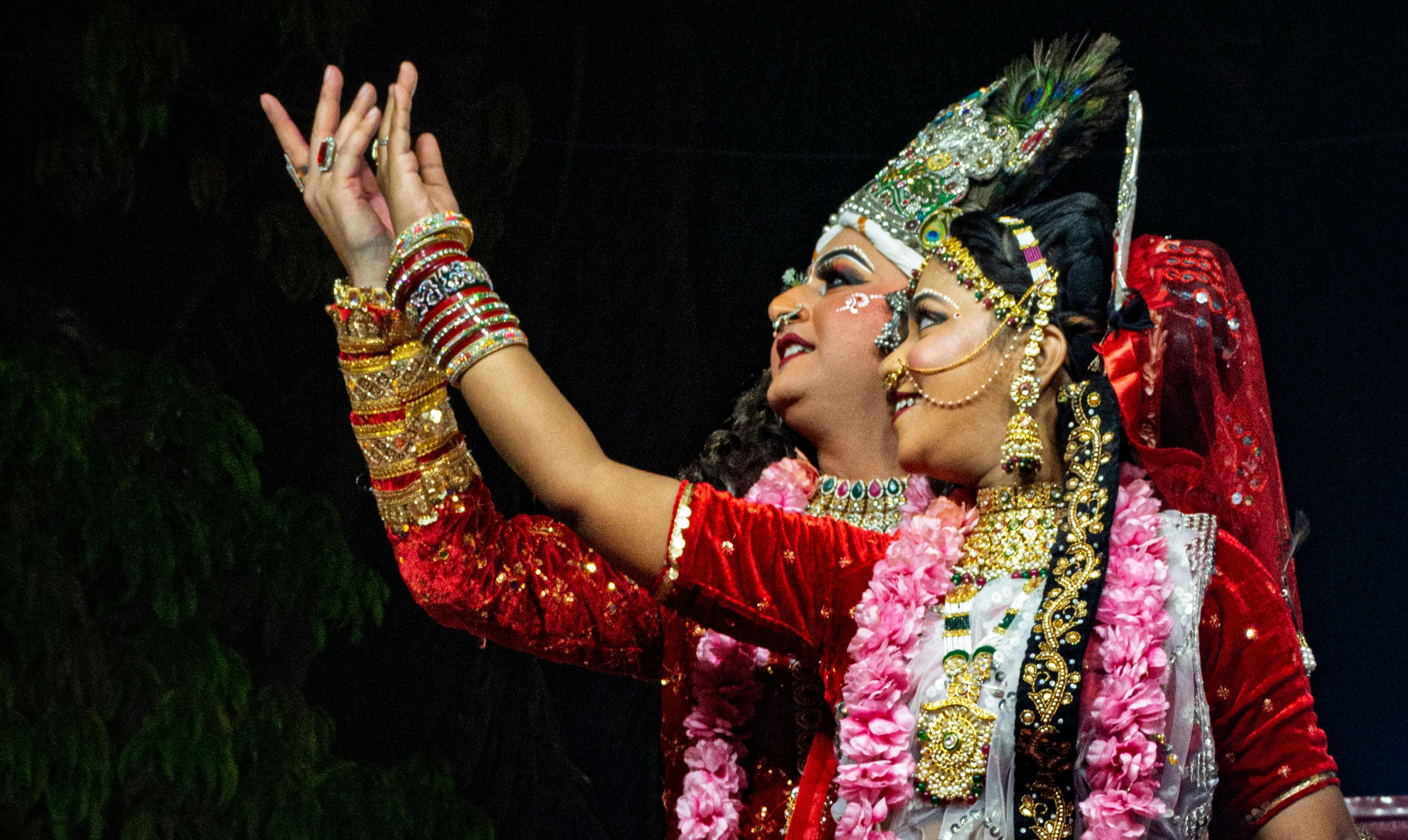 Grace in Motion: Dual Dancers in Traditional Regalia
