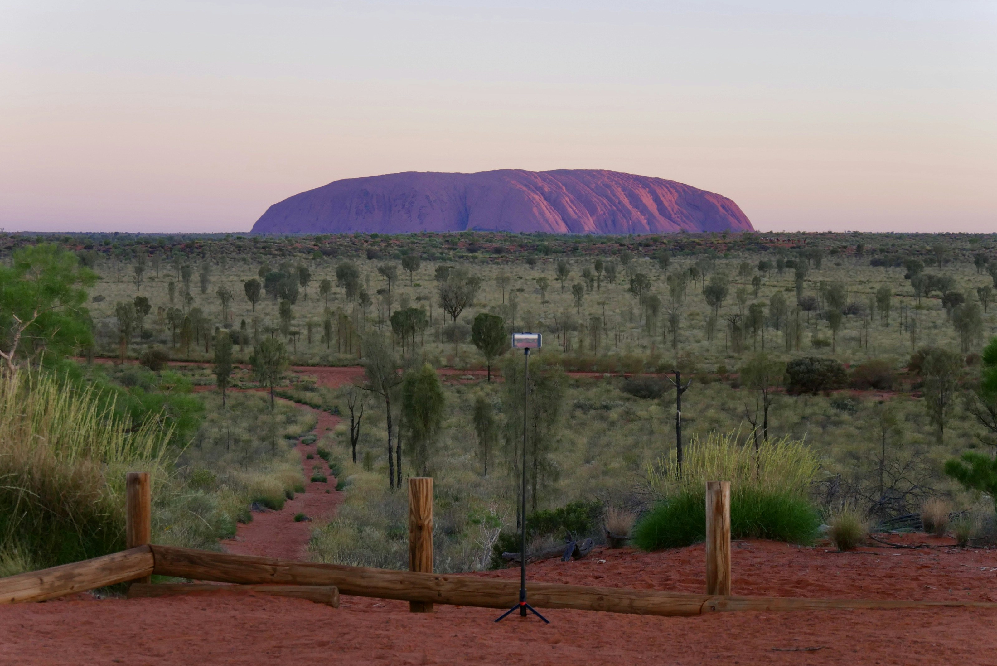 Red Desert Trail with a Distant Monolith