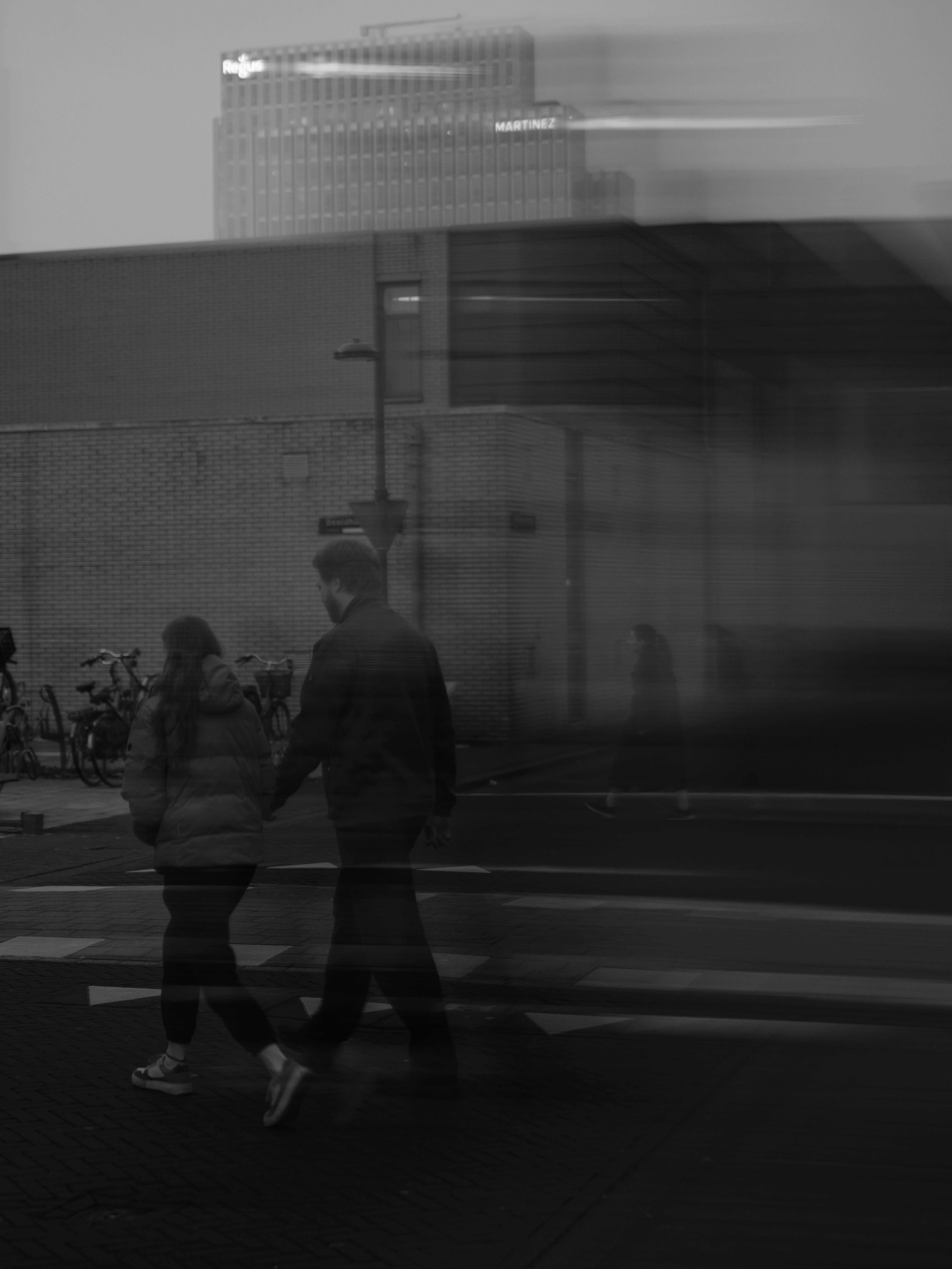 Motion in the City: Ghostly Passersby through a Blurred Glass