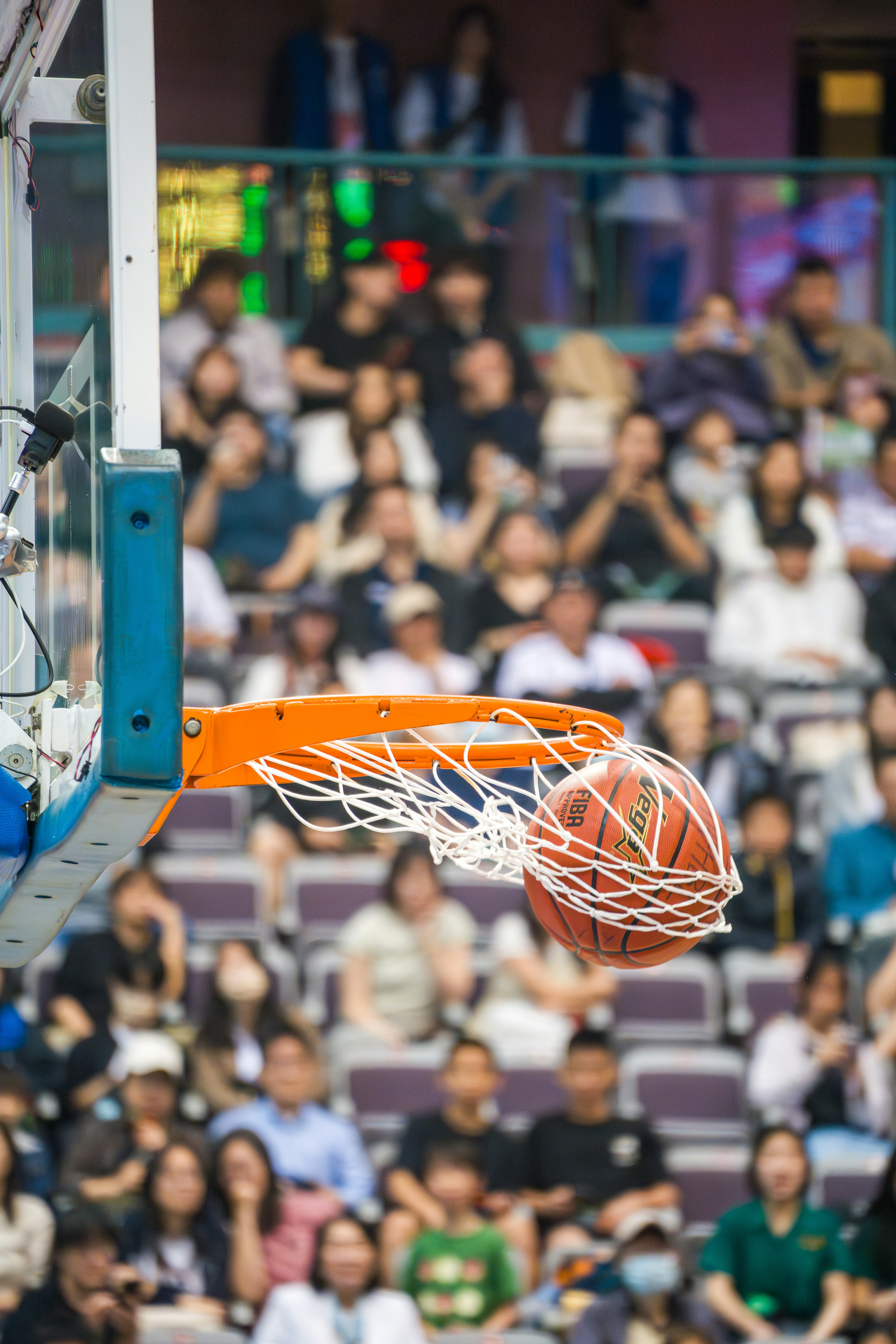 Through the Hoop: Ball in Flight Beneath the Orange Rim