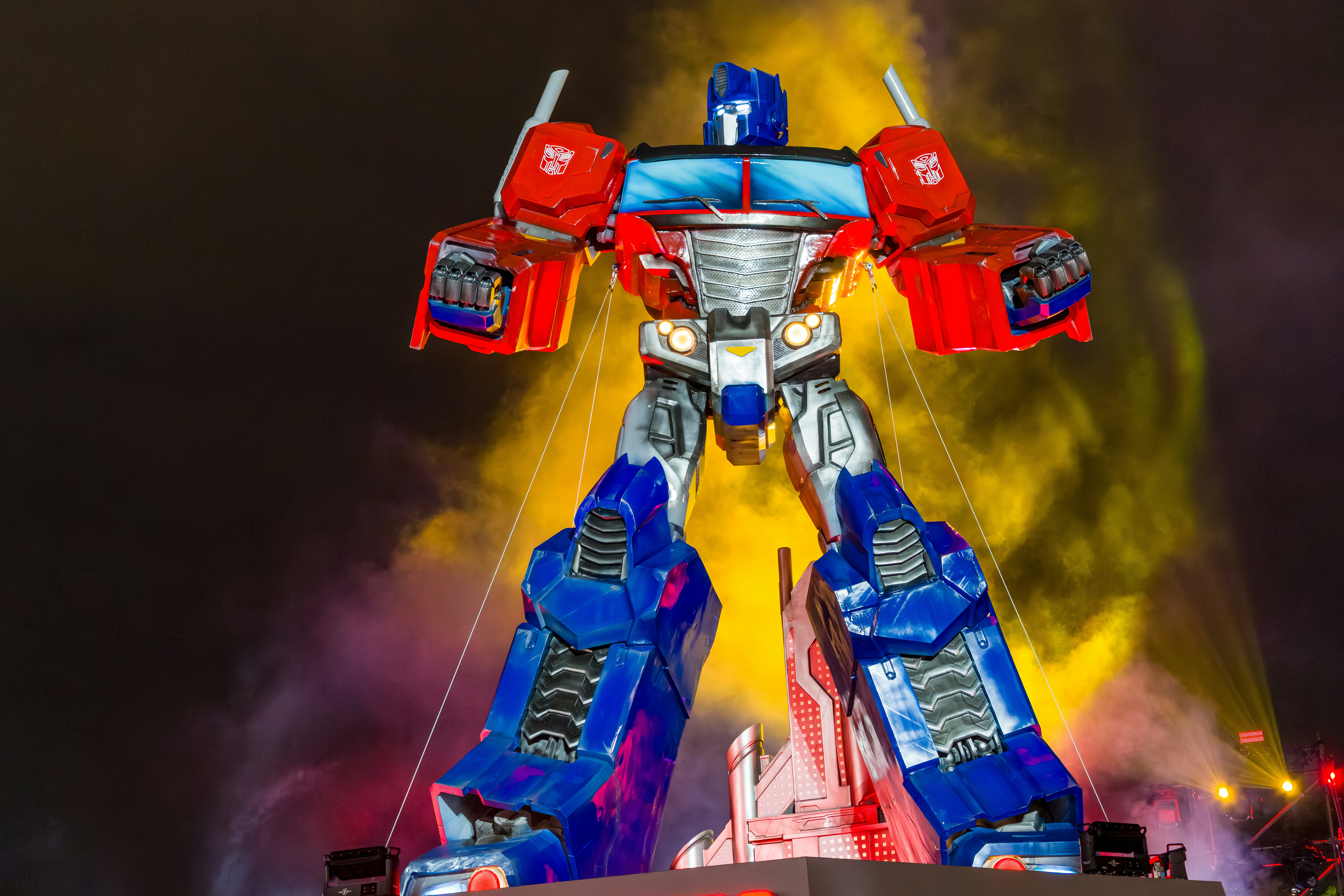 Rise of the Colossal Autobot: Neon Smoke and Rocket Fire
