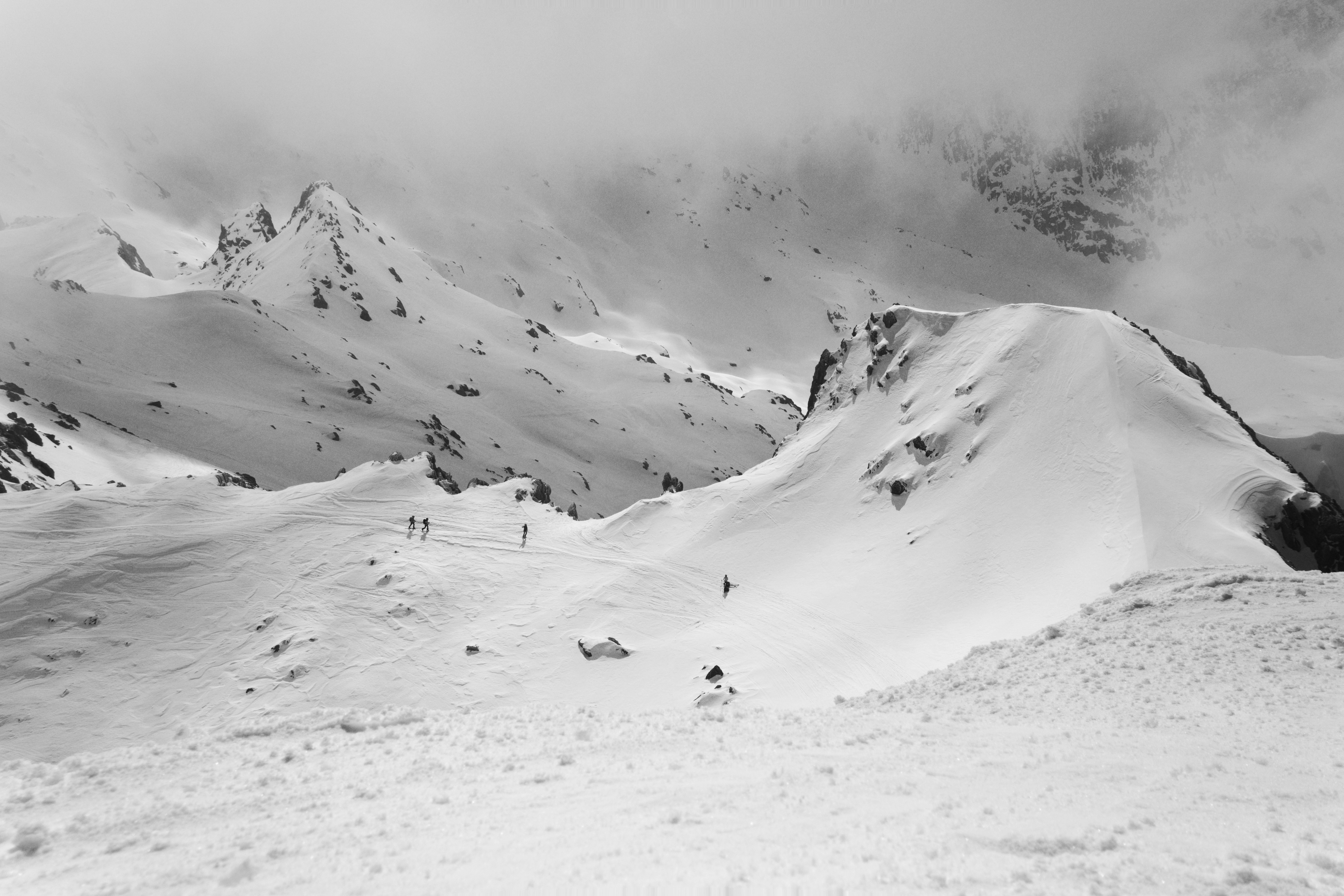 Snowbound Ridge: A Silent Ascent under Low Clouds