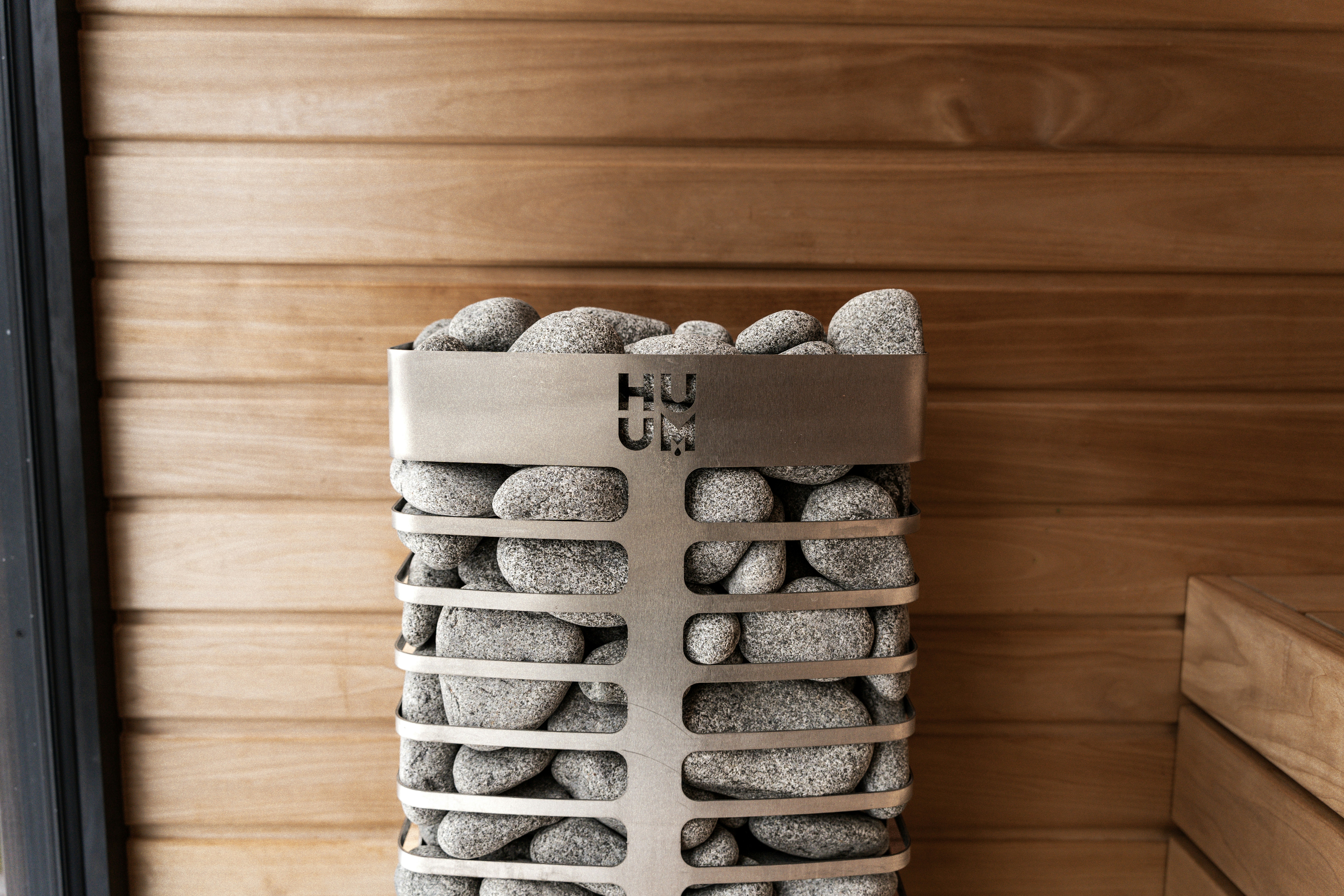 Stony Sauna Vessel: A Concrete Heater Embraced by Warm Wood