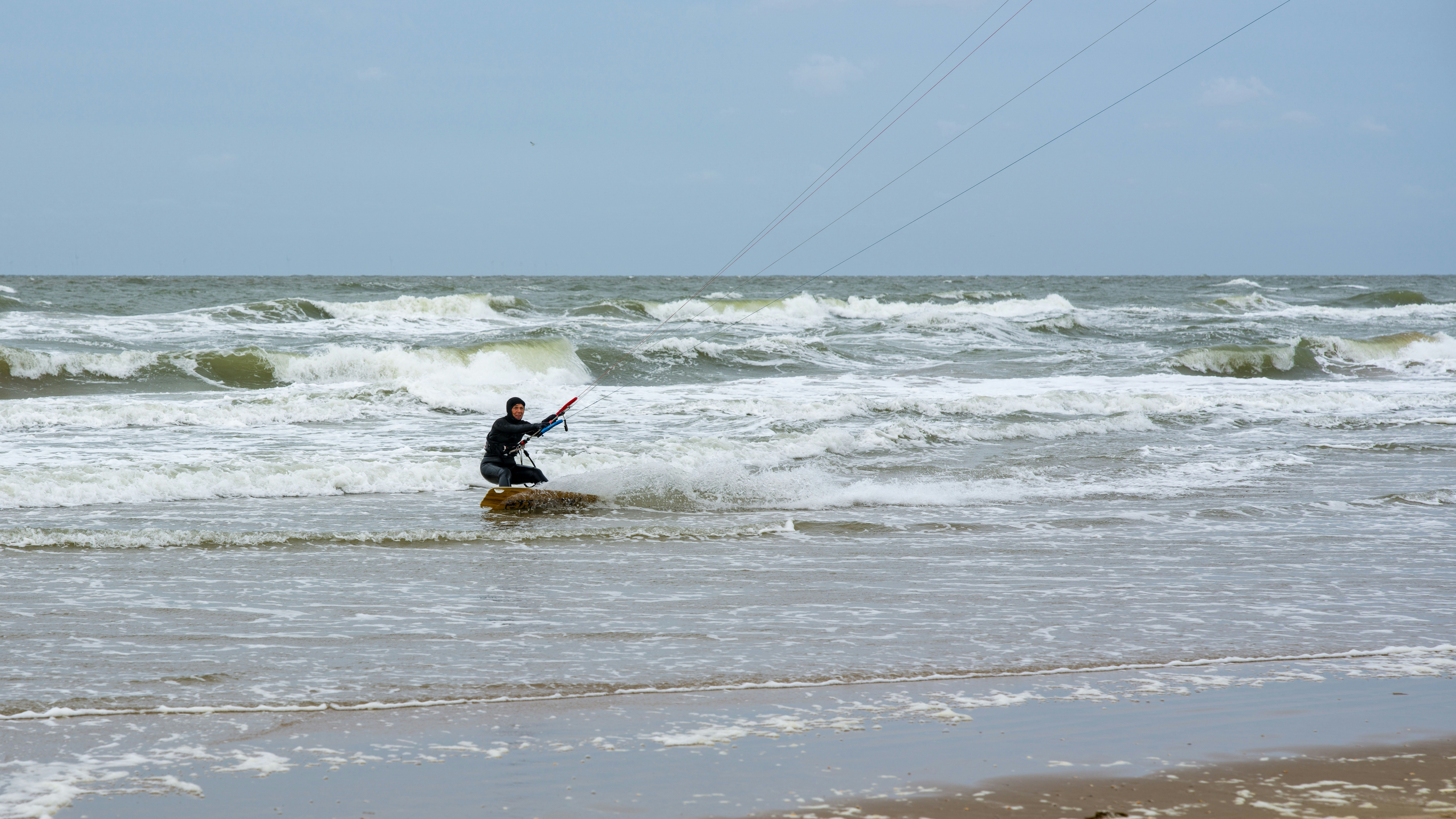 Kite Surfer in the Lapping Shorebreak