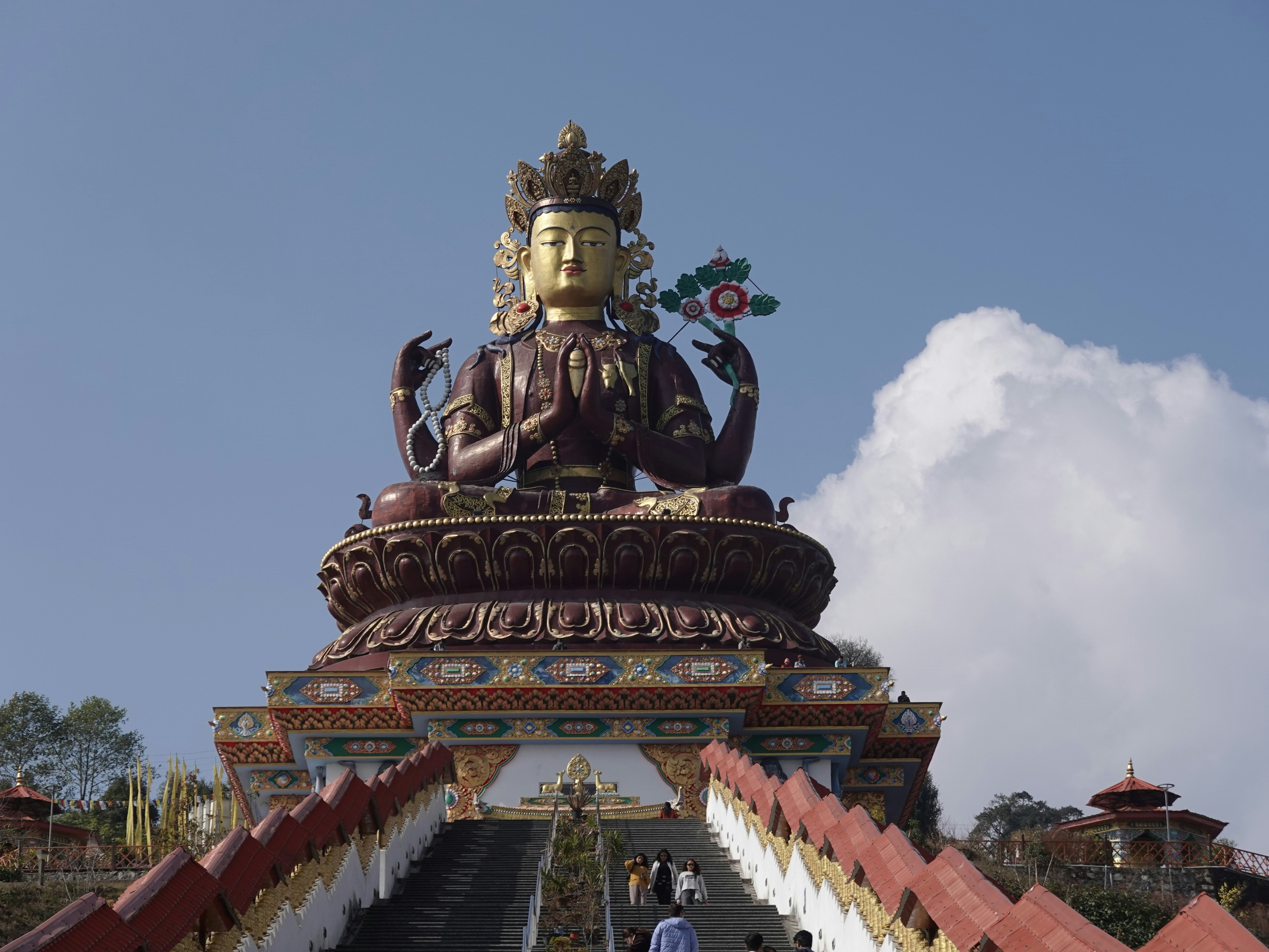 Gilded Buddha Arena: The Great Statue Rising Above the Stairway