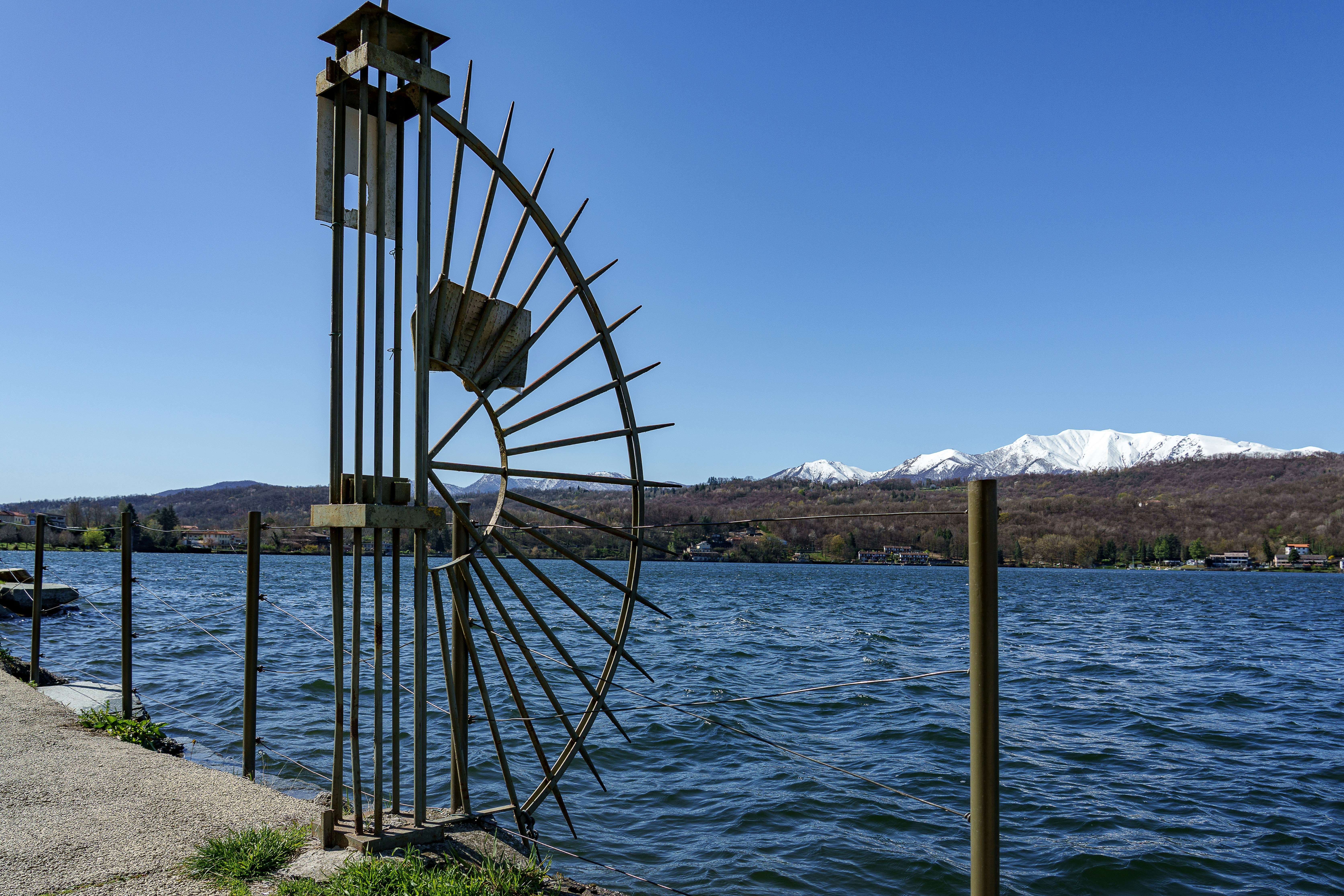 Iron Wheel by the Waterfront: A Quiet Mechanical Gaze