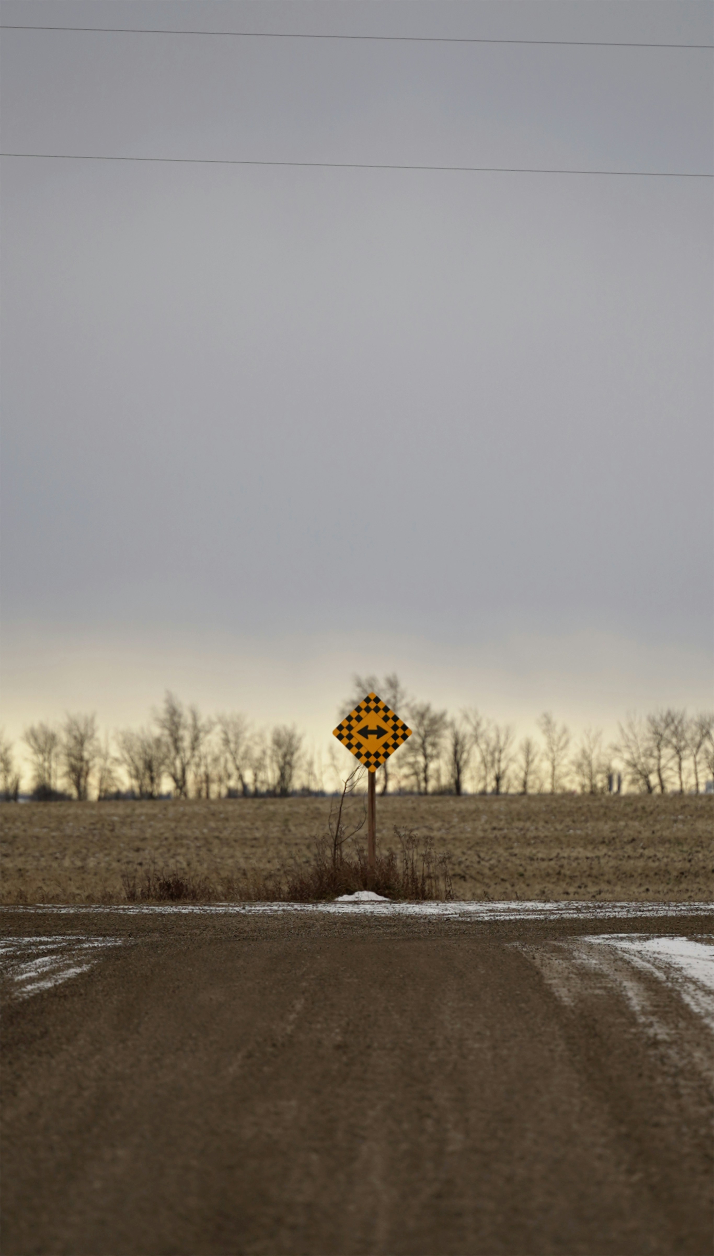 Yellow Diamond Sign Surrounded by Frosted Plain
