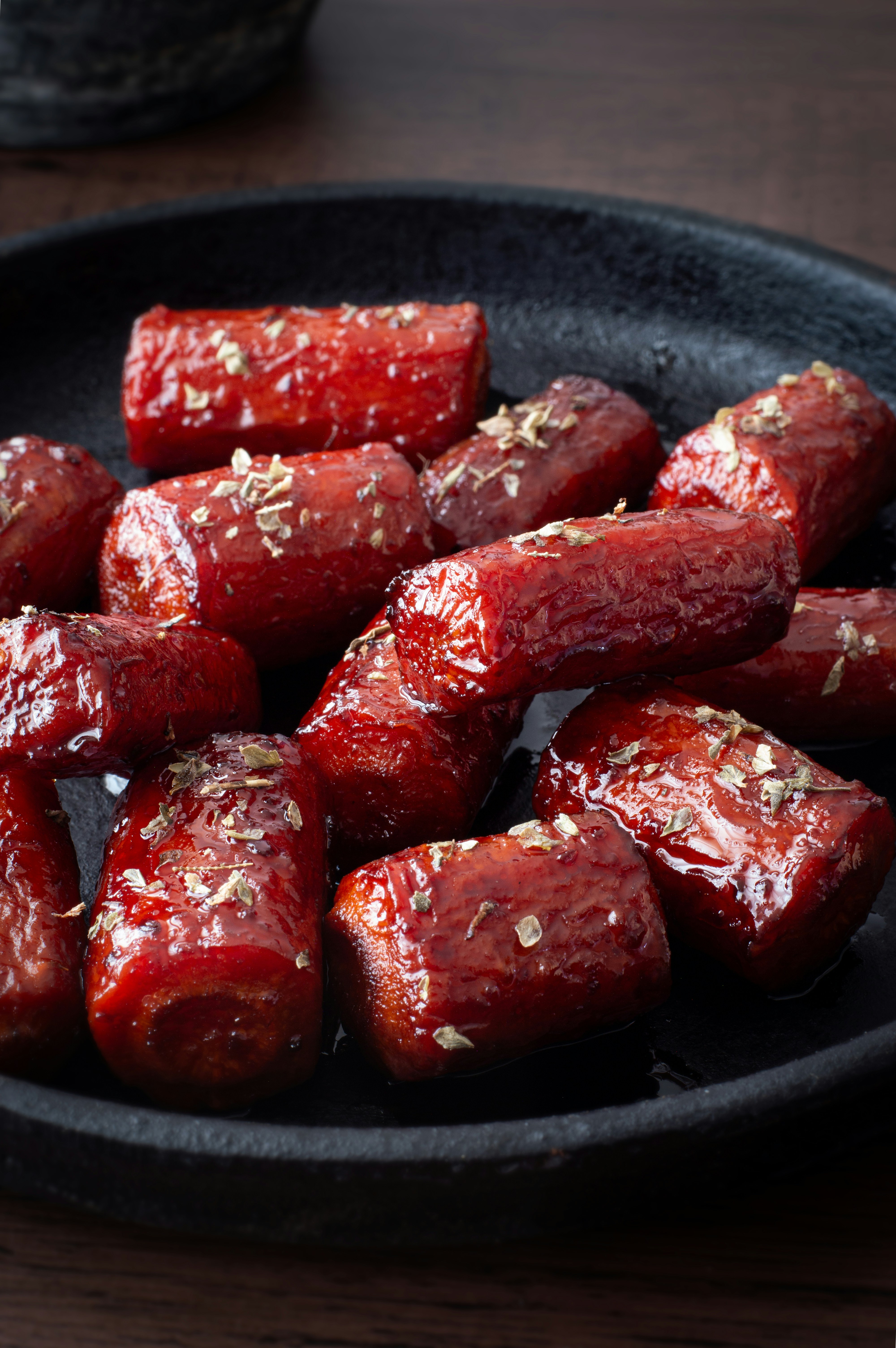 Scarlet Glazed Bites on a Cast Iron Canvas