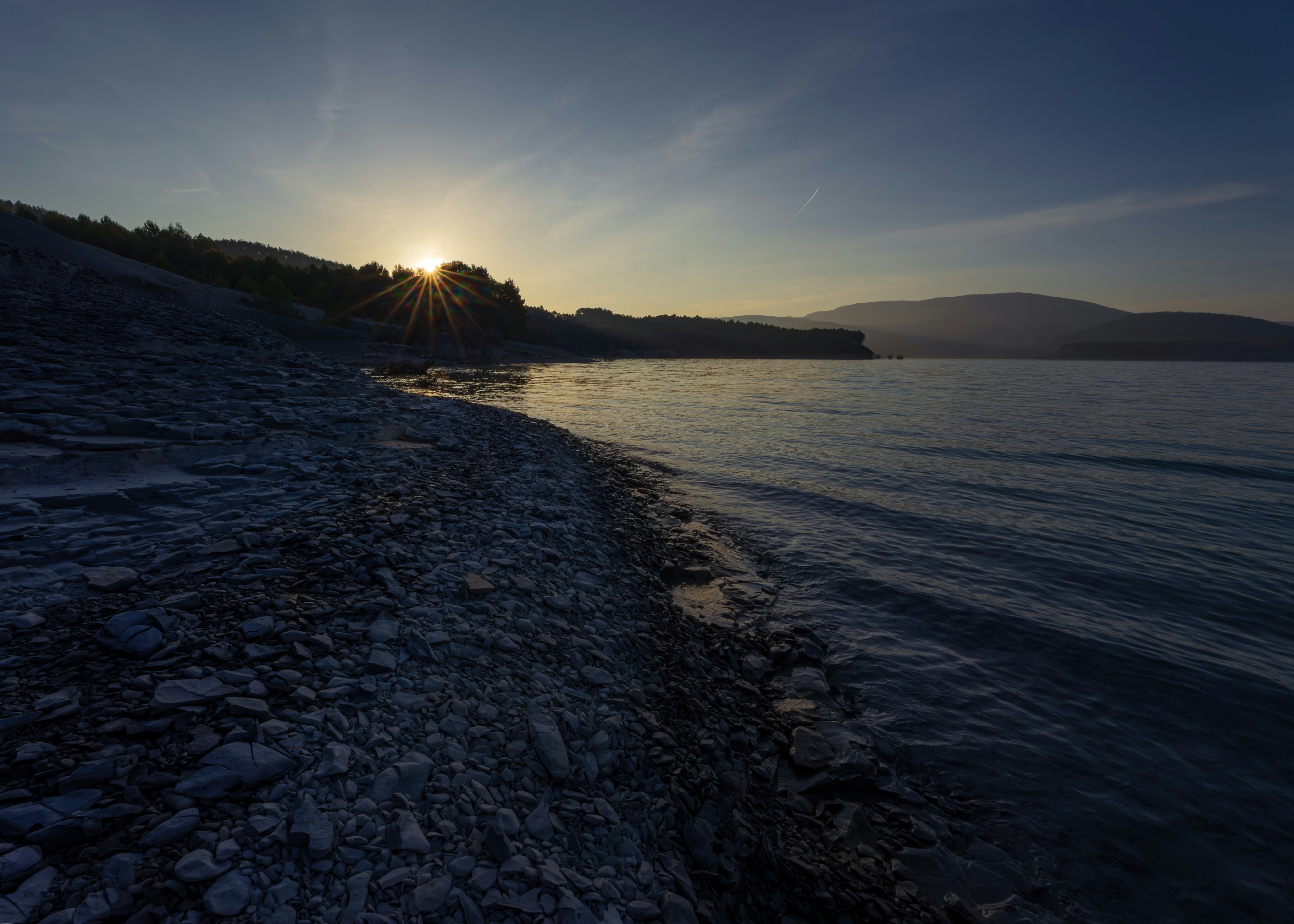 Dawn over a Pebble Beach: Quiet Sierras Beside a Still Lake