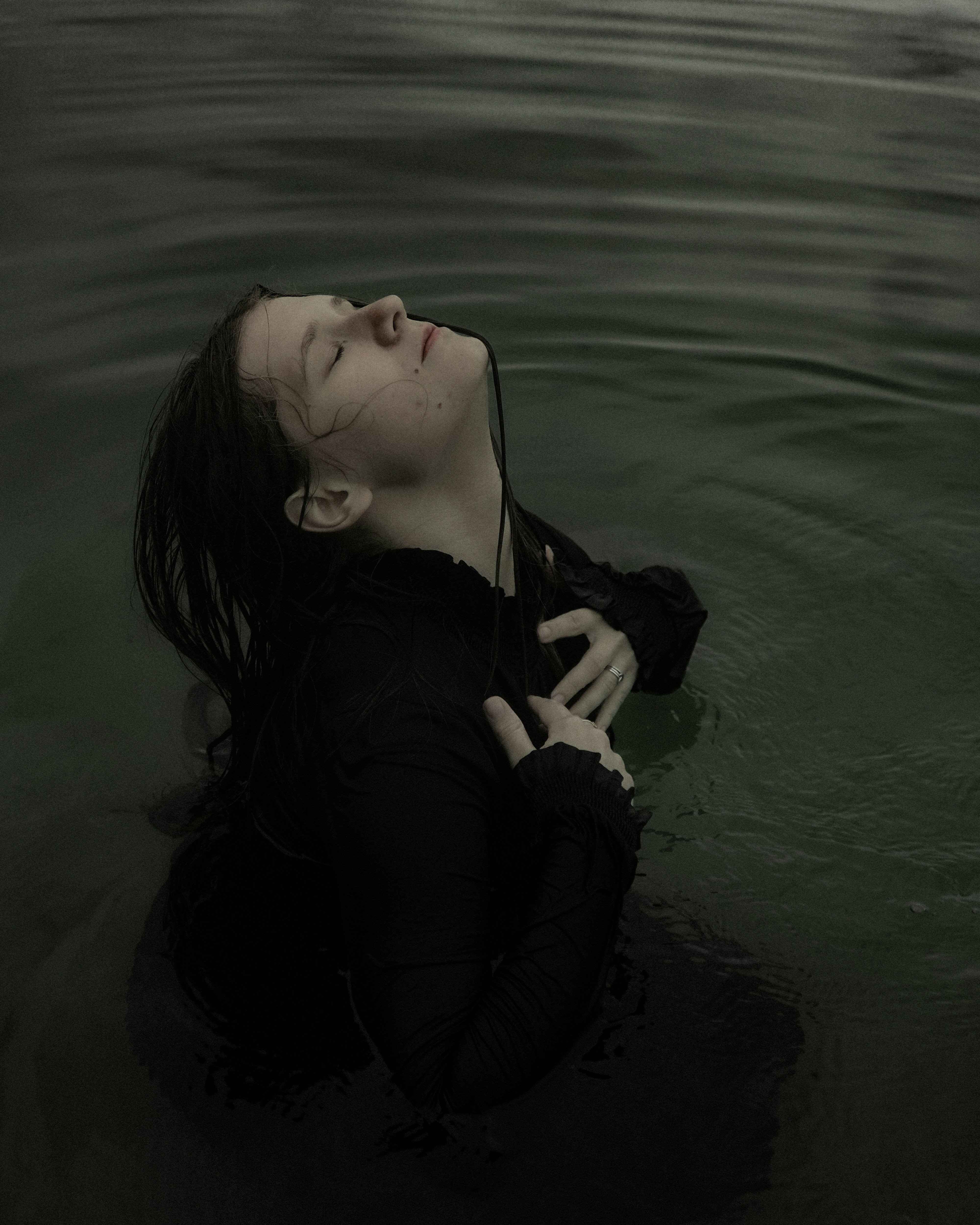 Submerged Quiet: A Serene Portrait in Dark Waters