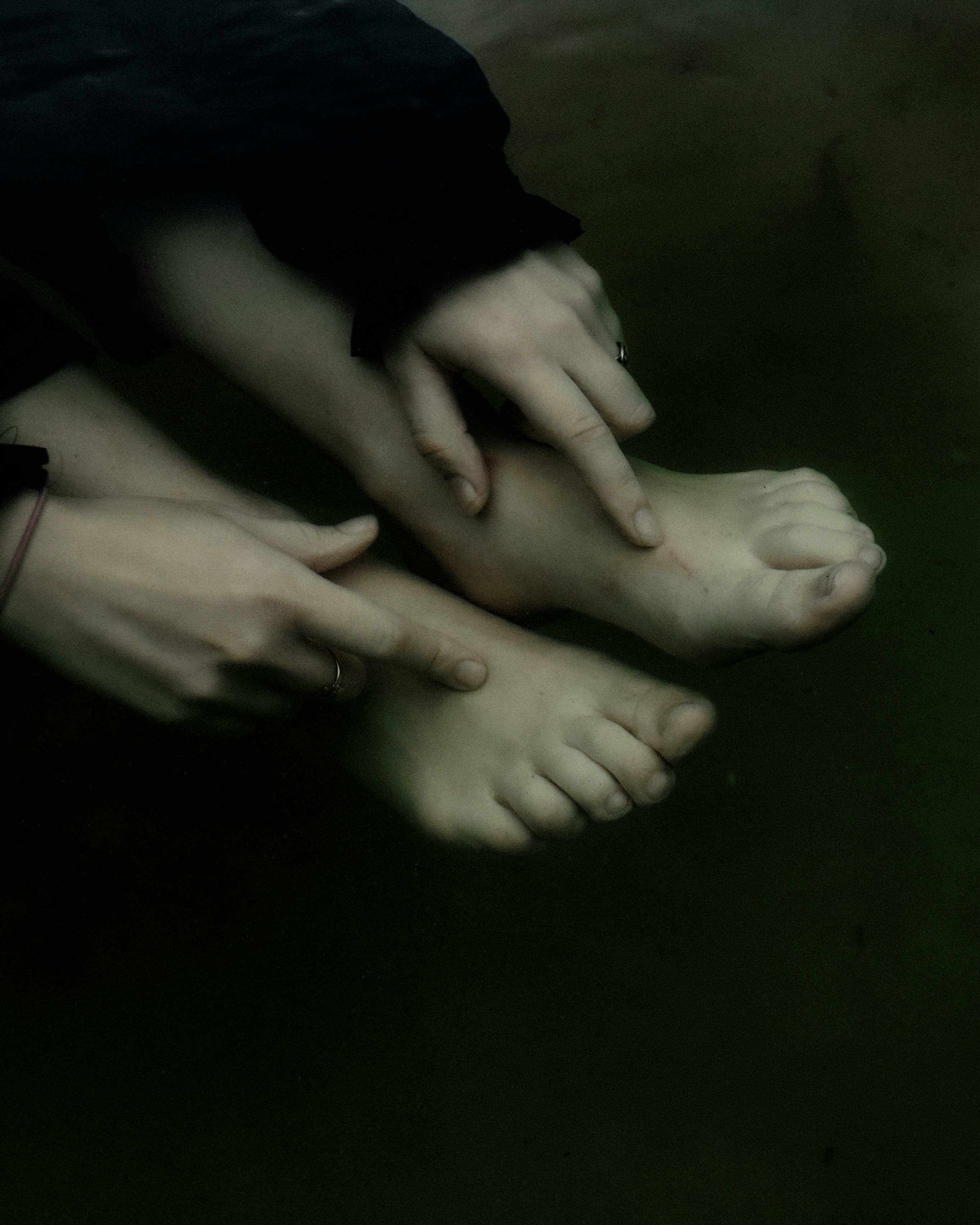 Hands by the Waterline: Quiet Touches in Low Light