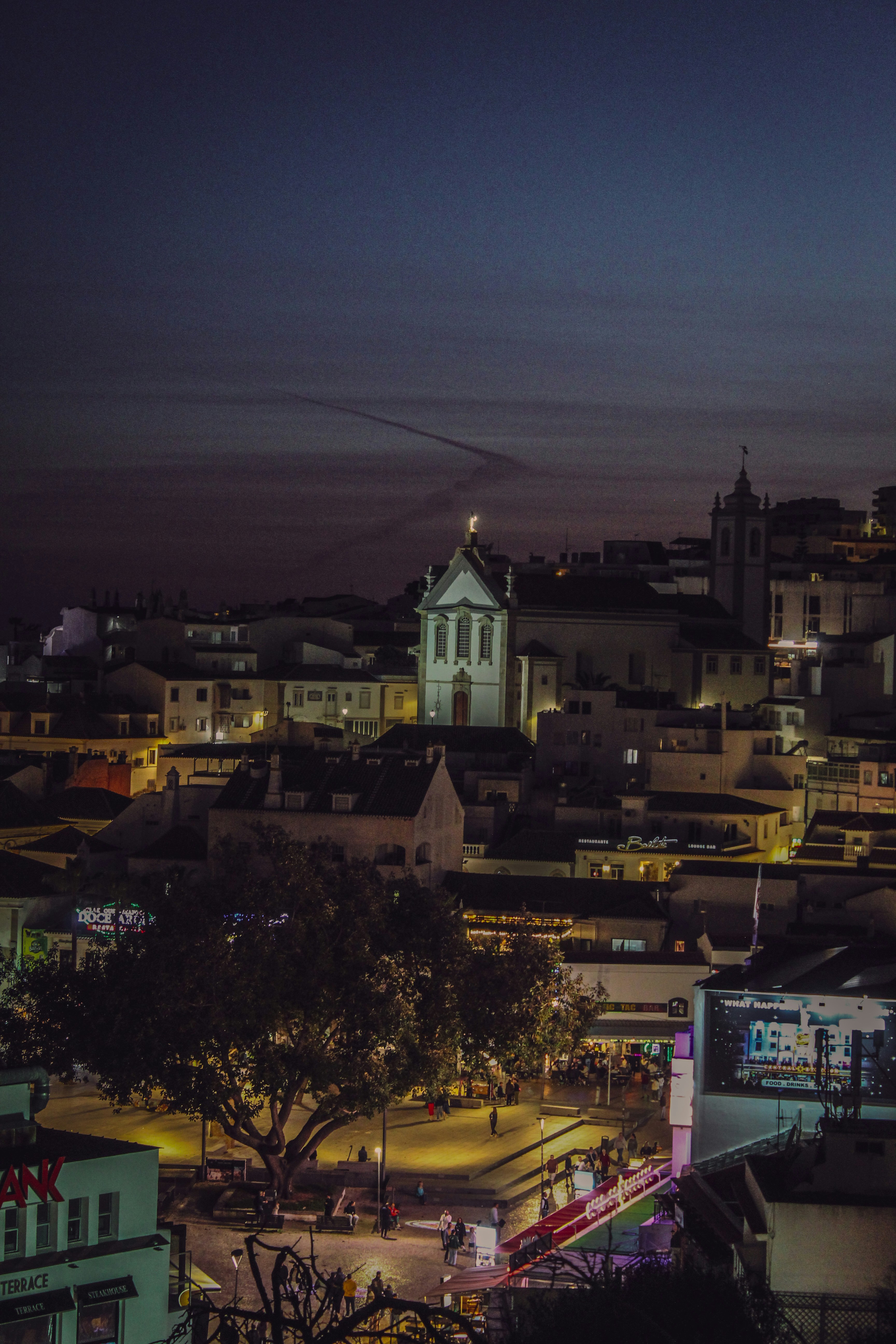 Night Switchbacks Over a Quiet Hill Town