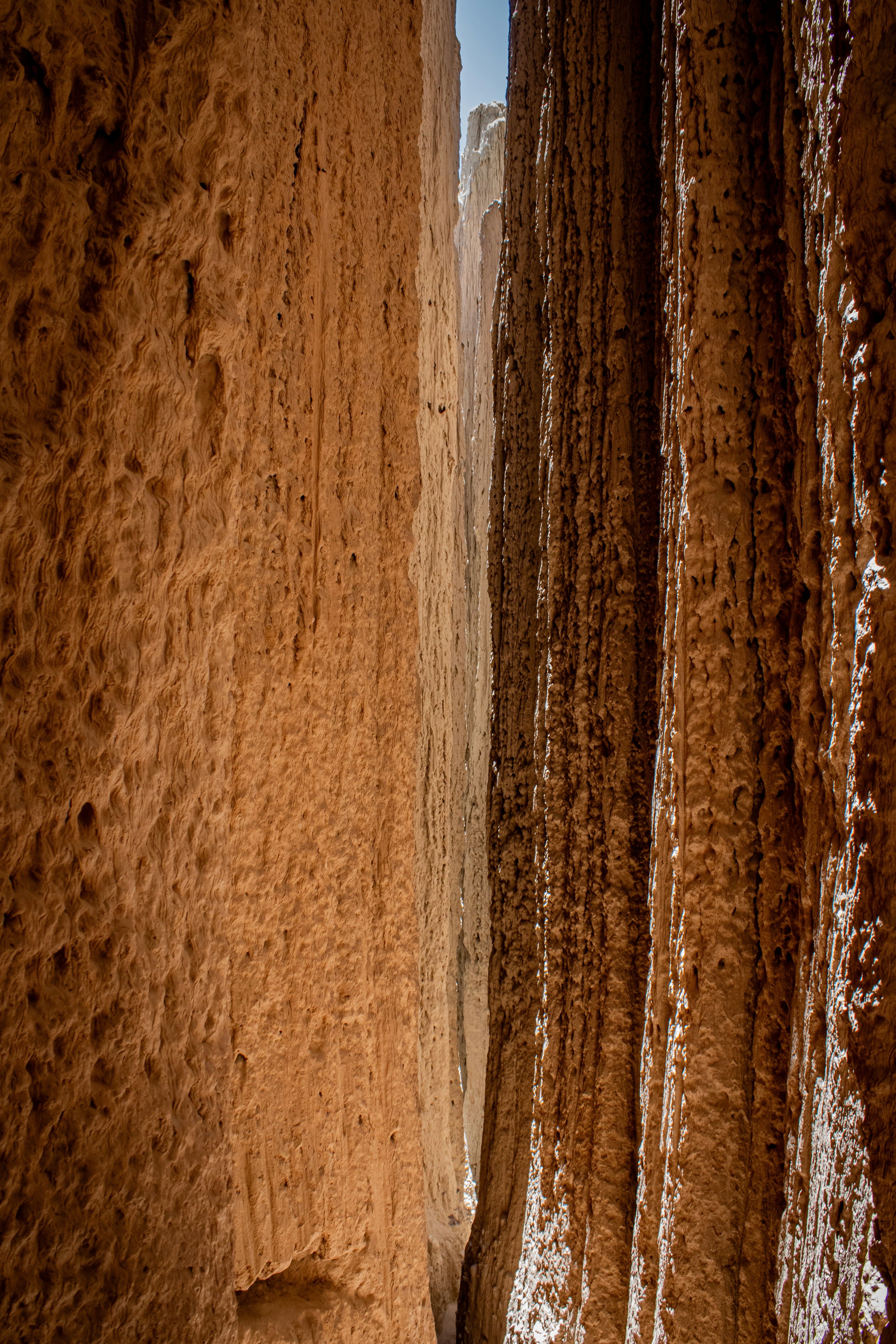 Vertical Canyon: Rusted Striations Drill into Light
