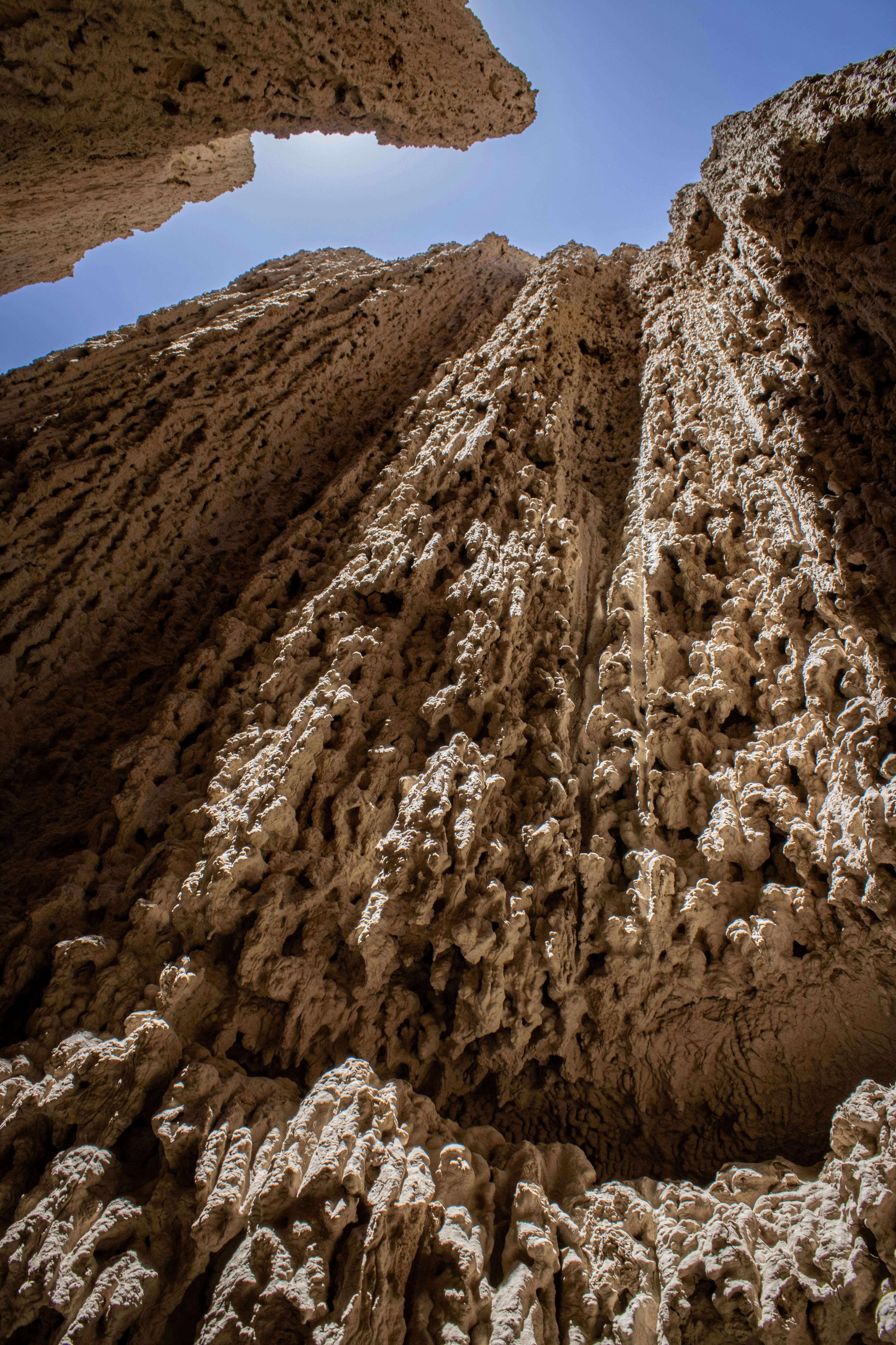 Skyward Canyon: Jaw-dropping limestone towers against a cobalt opening