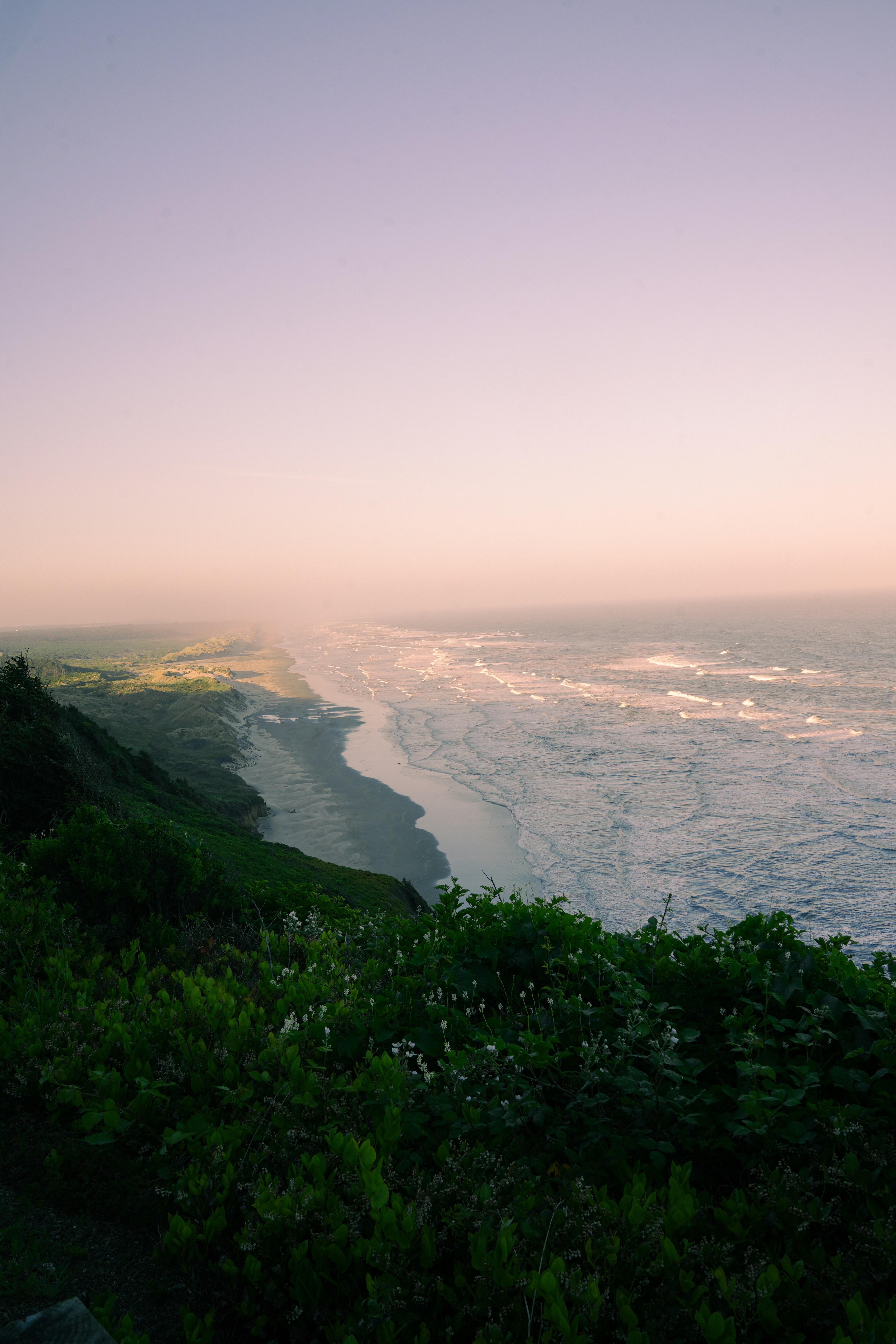 Sunset Over Green Cliffs and Ocean Veil