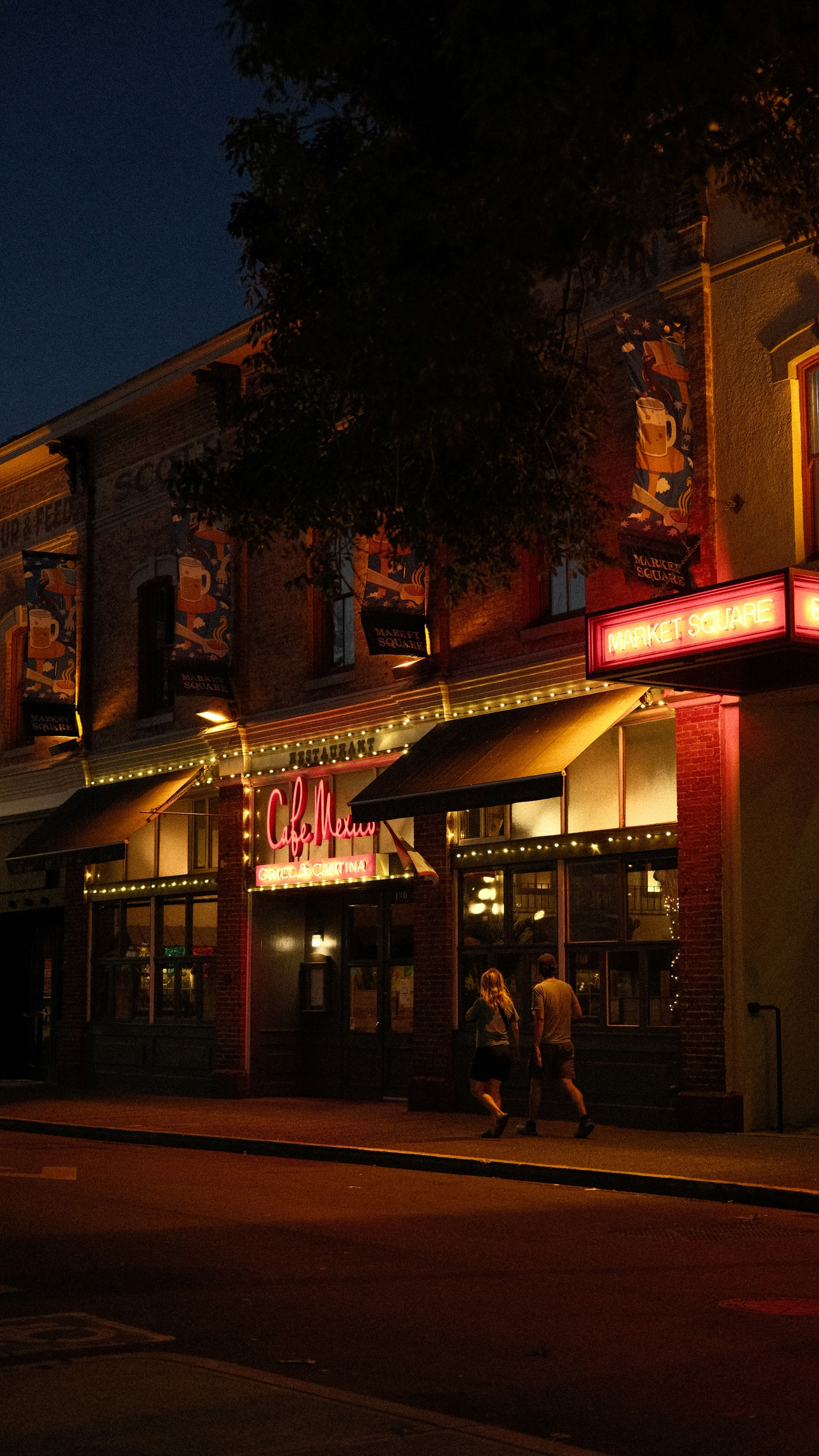 Neon Café on Market Square at Dusk