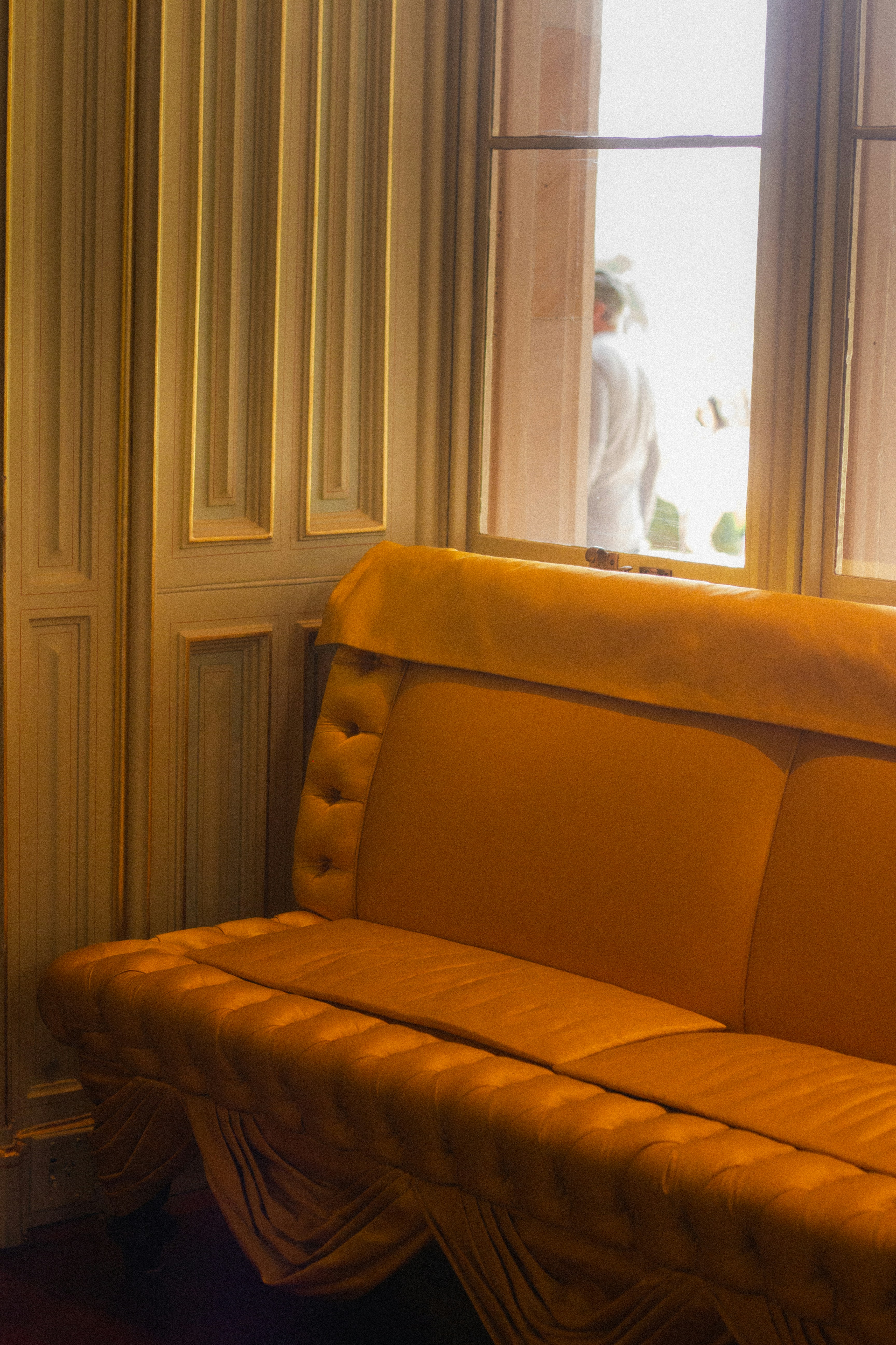 Golden Upholstery and Light Through a Split Window