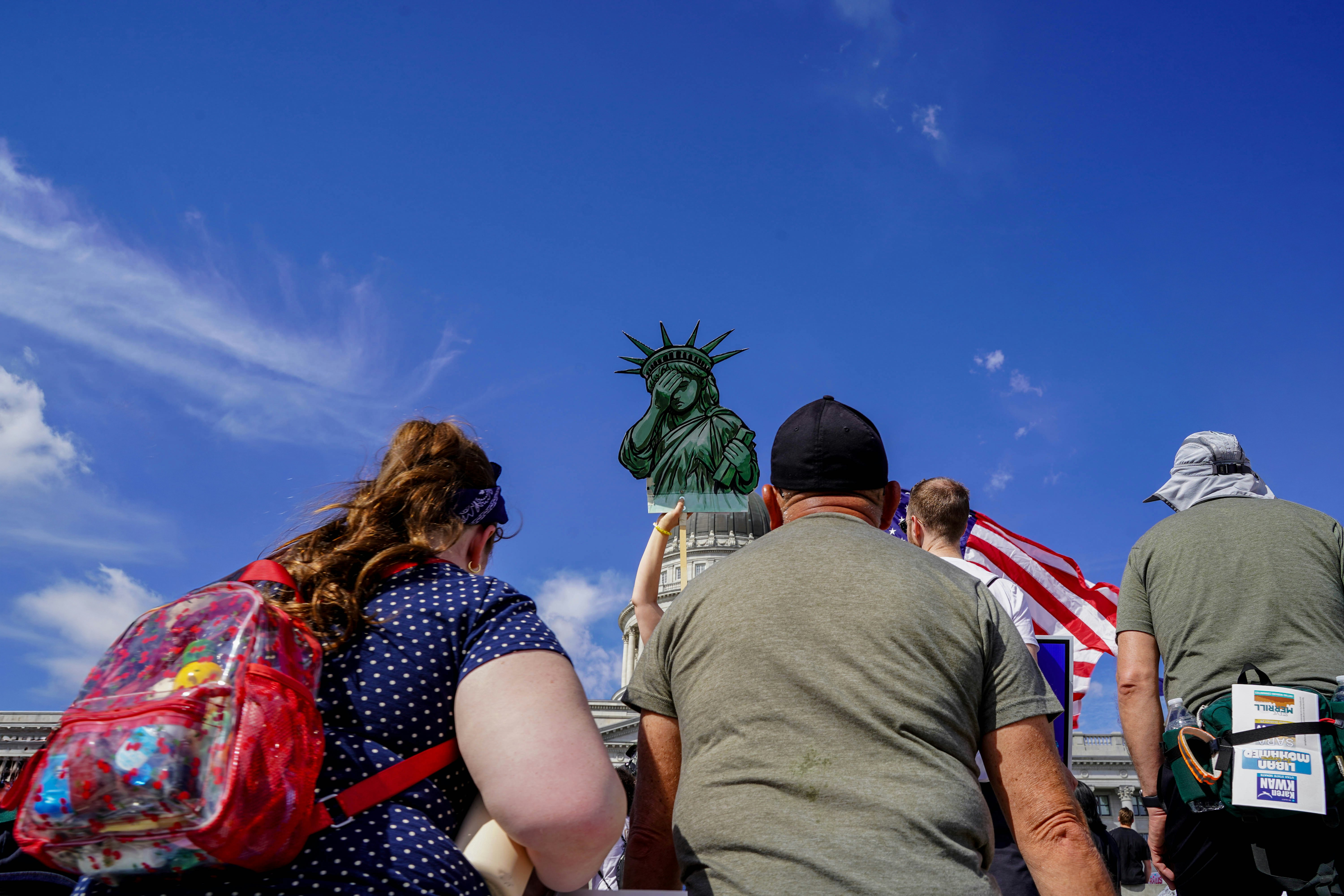 Facing Liberty: A Back View Beneath the Statue of Liberty