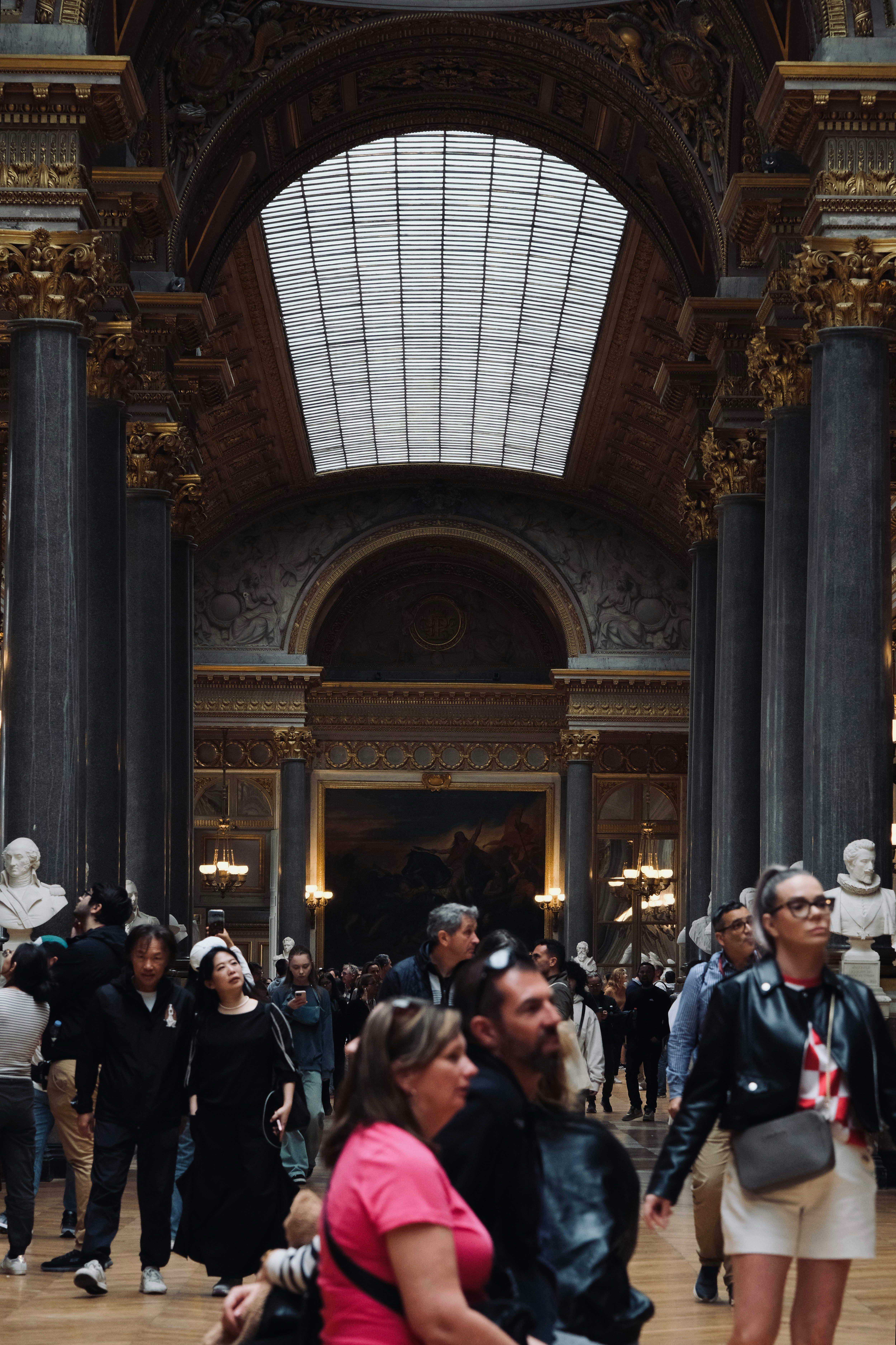 Hushed Crowd Beneath the Grand Archways