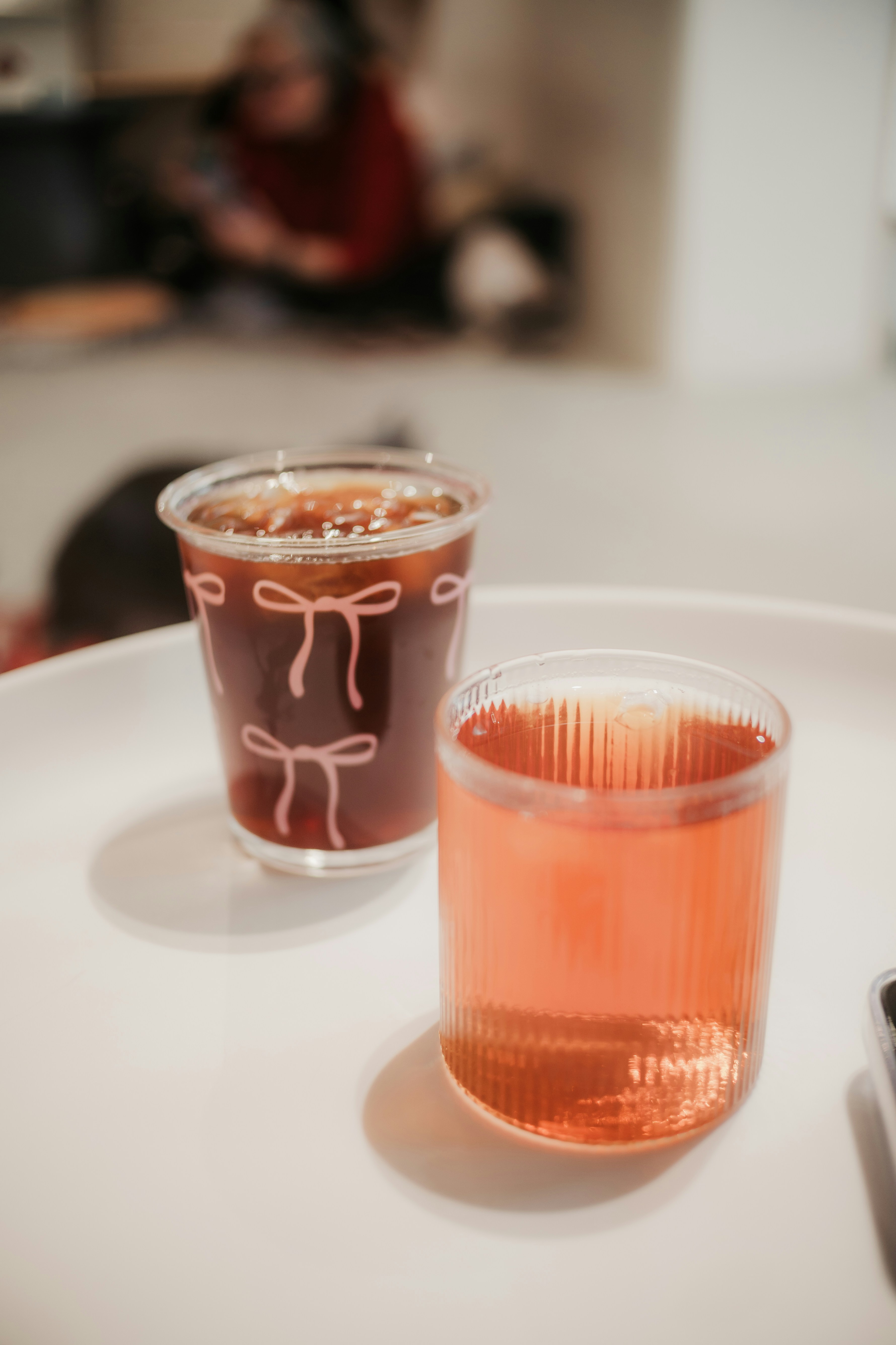 Two Glasses, One Table: A Soft Focus Moment in a Café