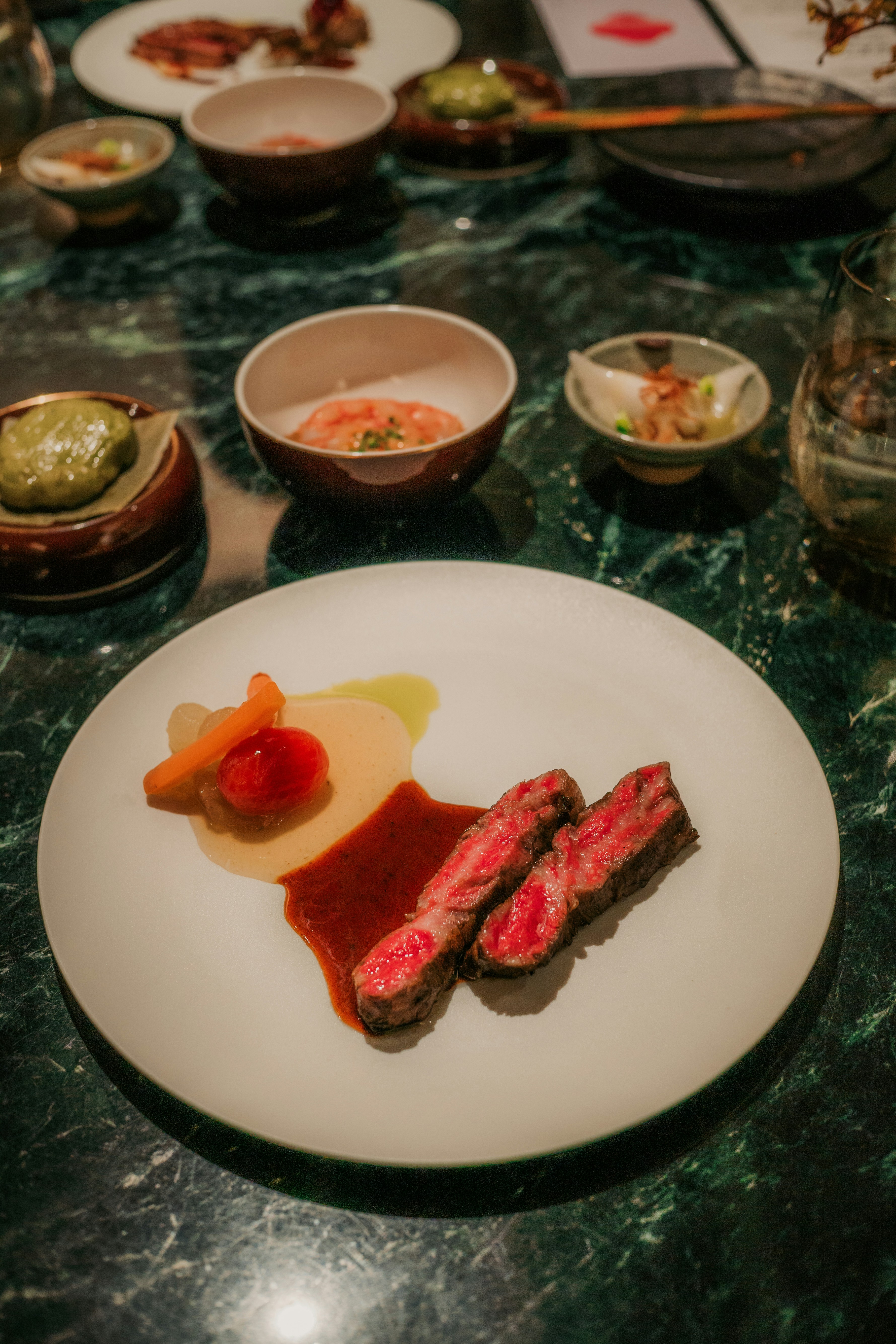 Juxtaposed Slices: Tender Wagyu Beneath a Studio Gray Table