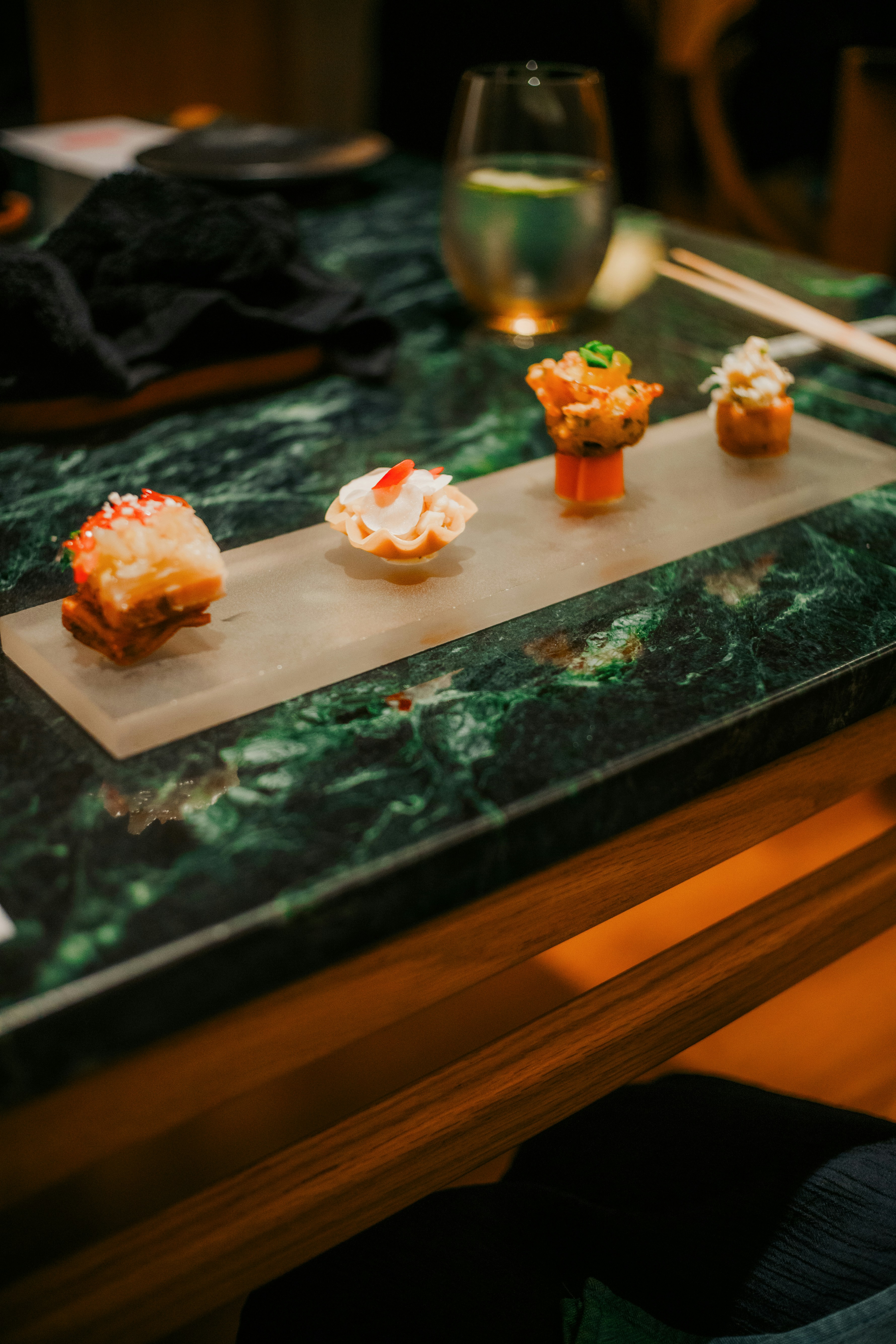 Quiet Sushi Parade on a Marble Stage