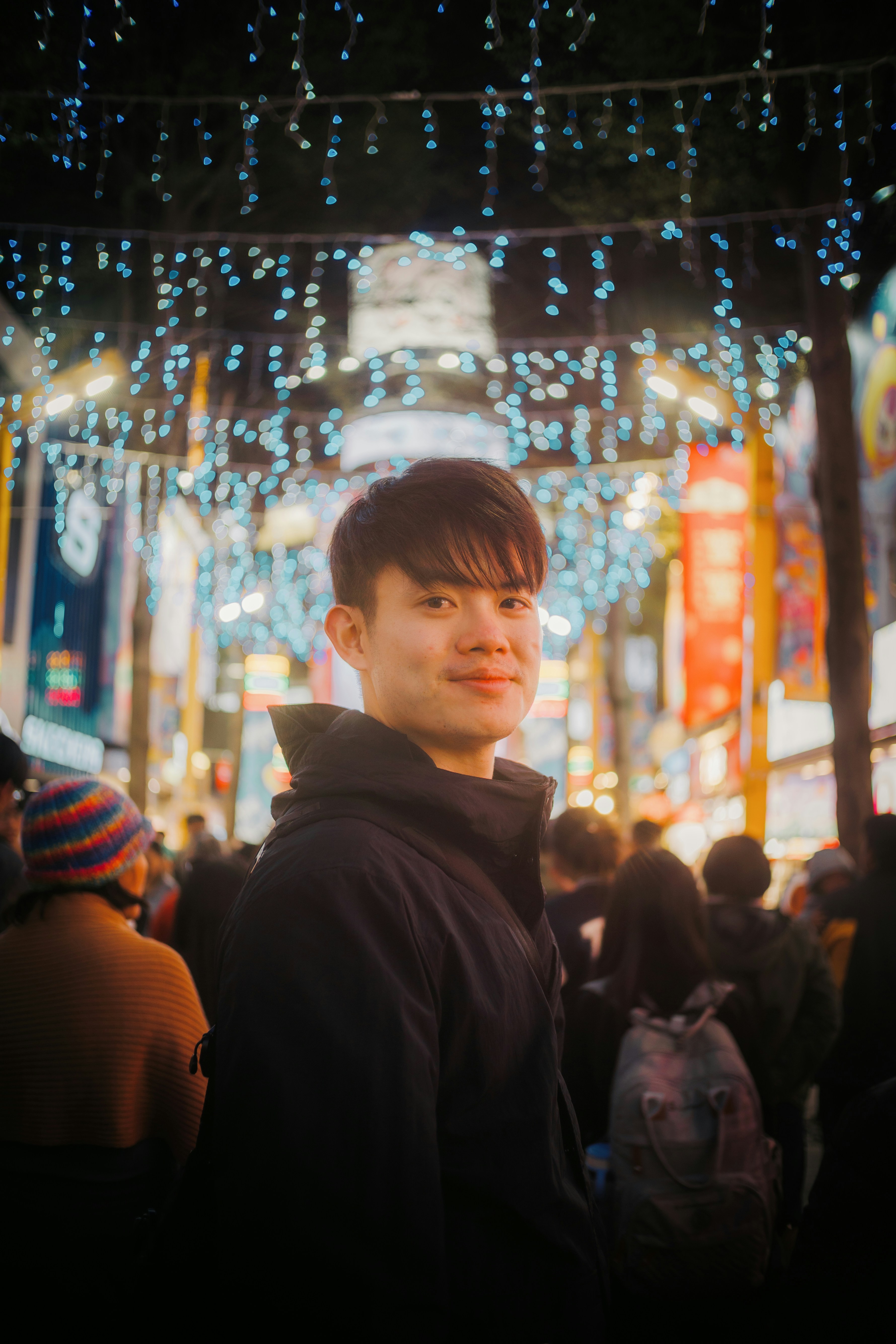 City Lights Halo: A Confident Portrait Under Night Market Glow